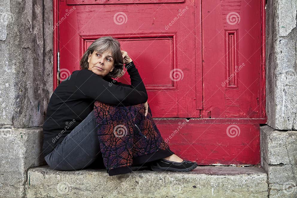 Woman Sitting on Door Stoop Stock Photo - Image of elder, exterior ...