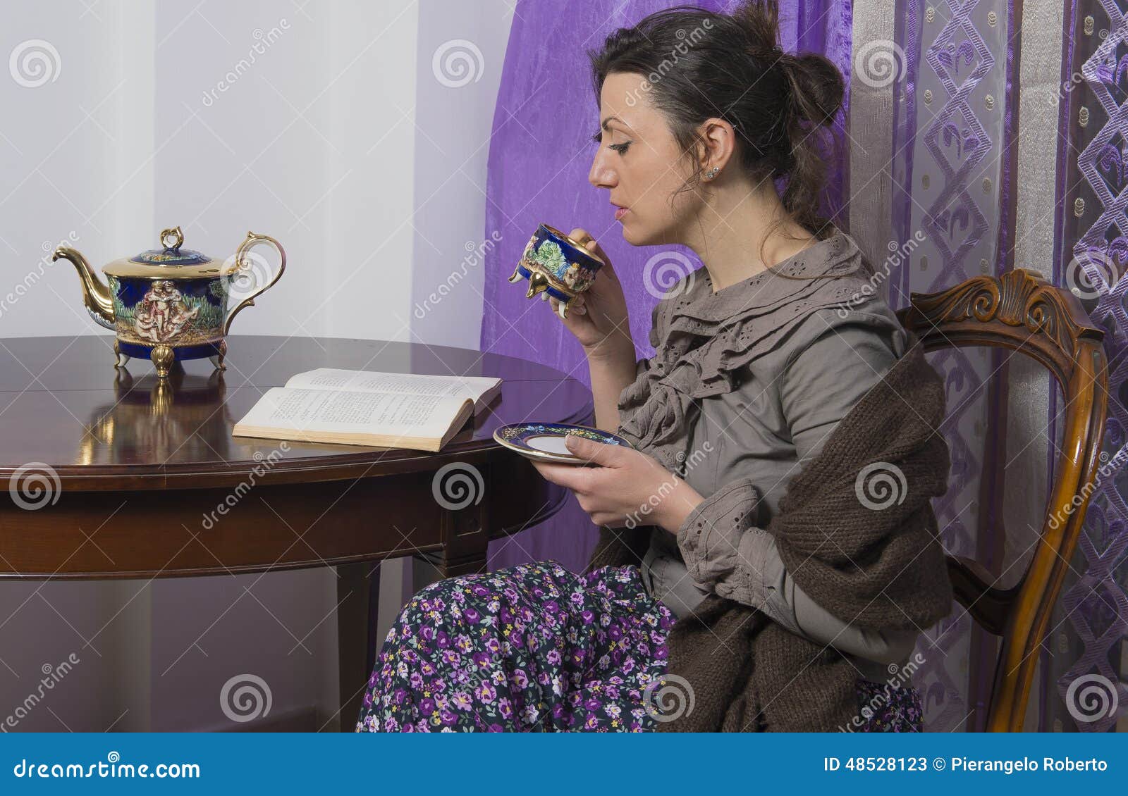 Woman Sitting Drinking while Reading Stock Image - Image of cute, clean ...