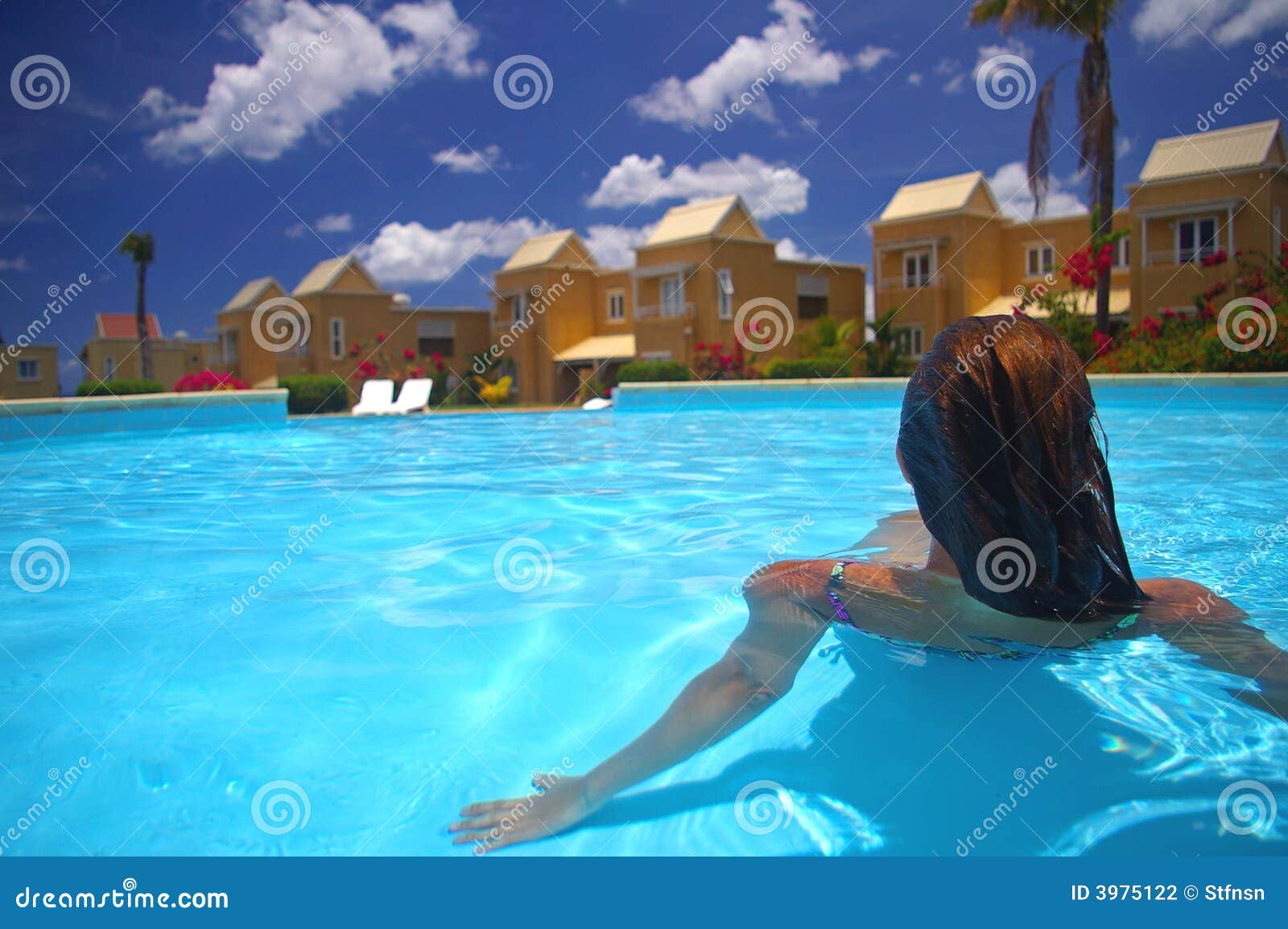 Woman Sitting by Edge of Pool Stock Photo - Image of women, holiday ...