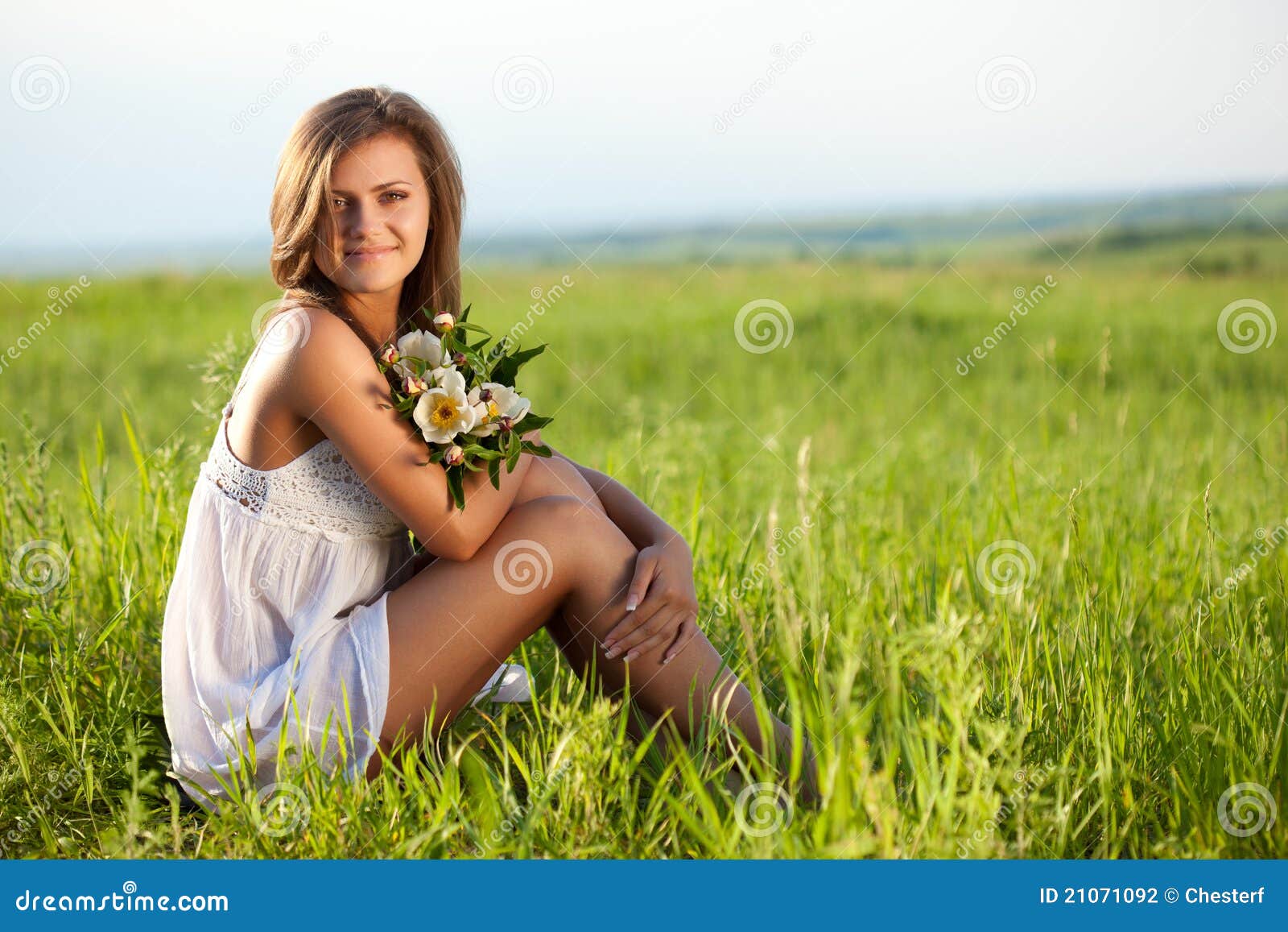 Woman sitting on field stock photo. Image of field, human - 21071092