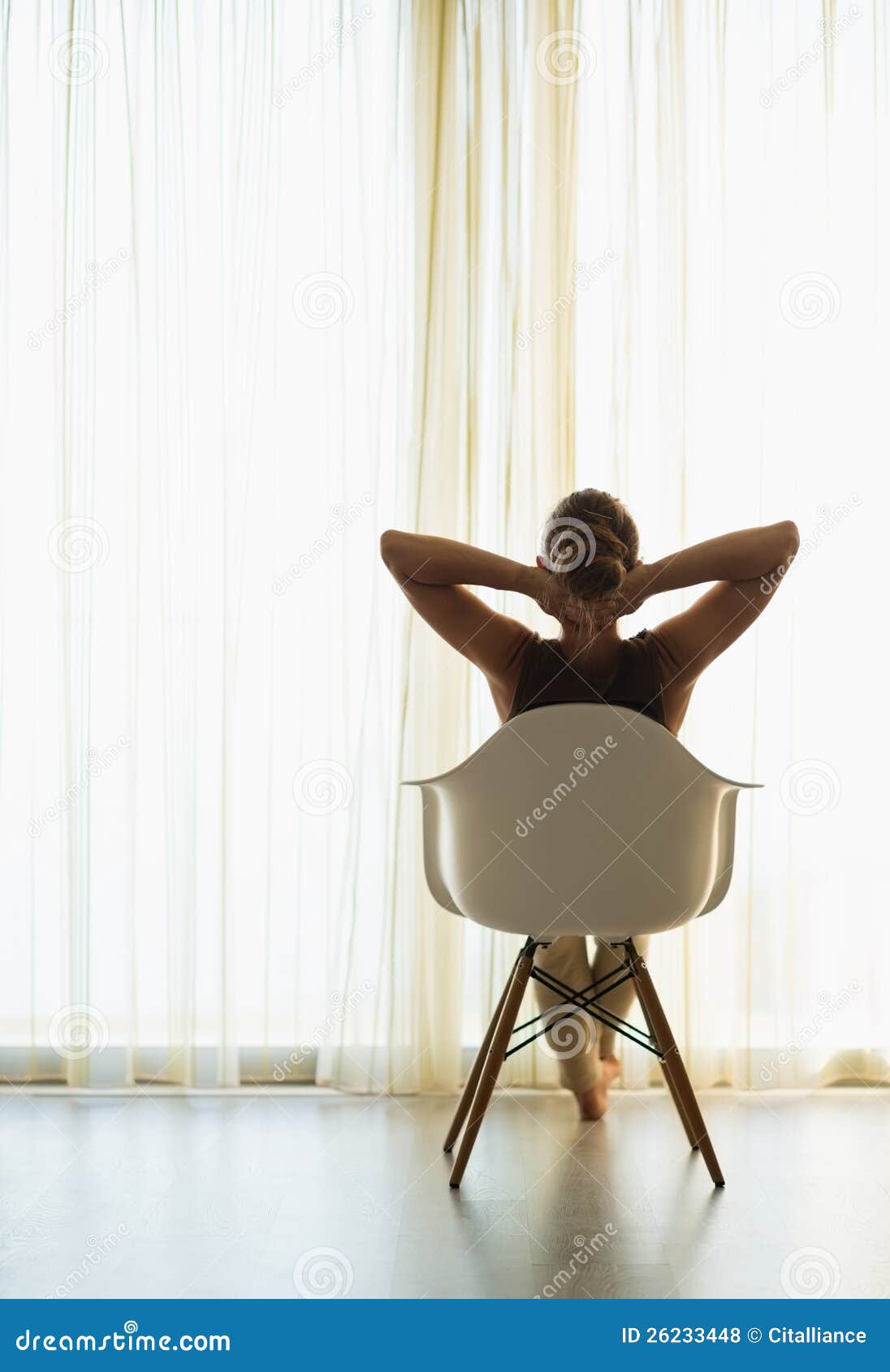Woman Sitting in Front of Window. Rear View Stock Photo - Image of ...