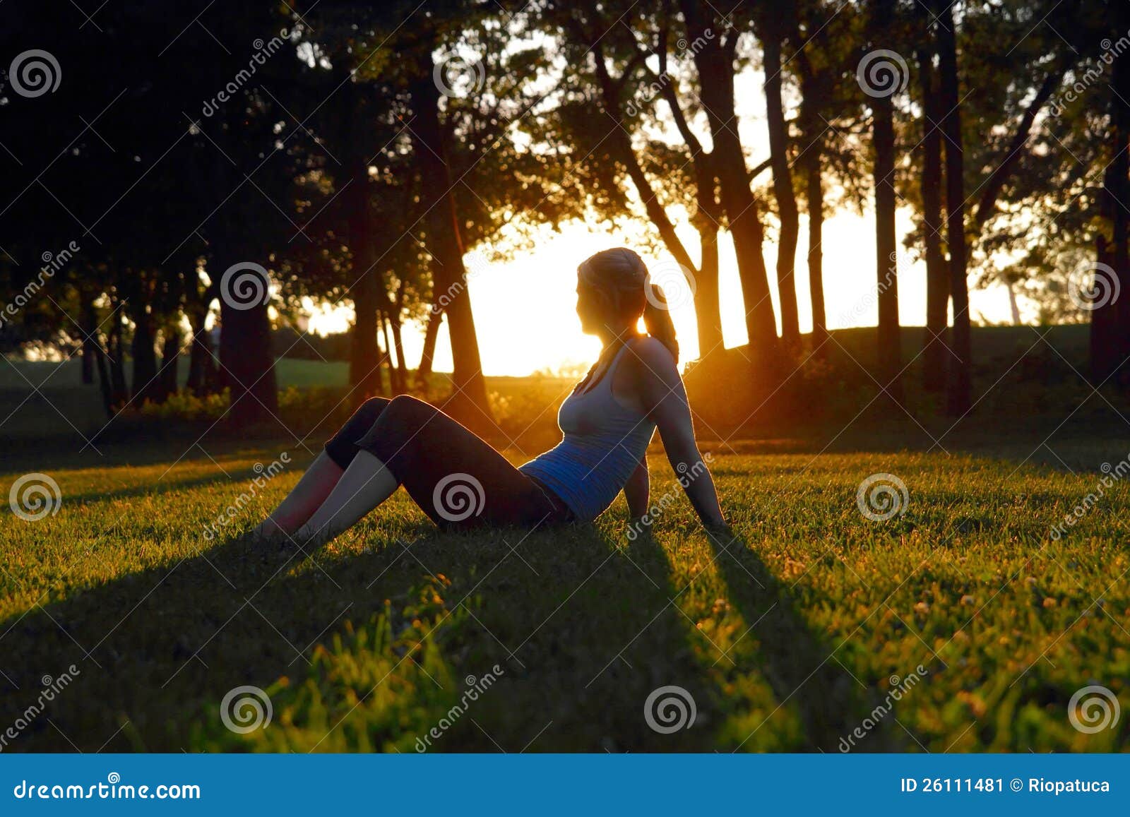 Woman Sitting In The Glow Of The Setting Sun Stock Image - Image of ...