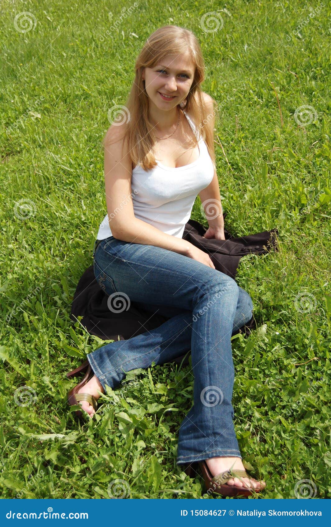 Woman sitting on the grass stock image. Image of green - 15084627