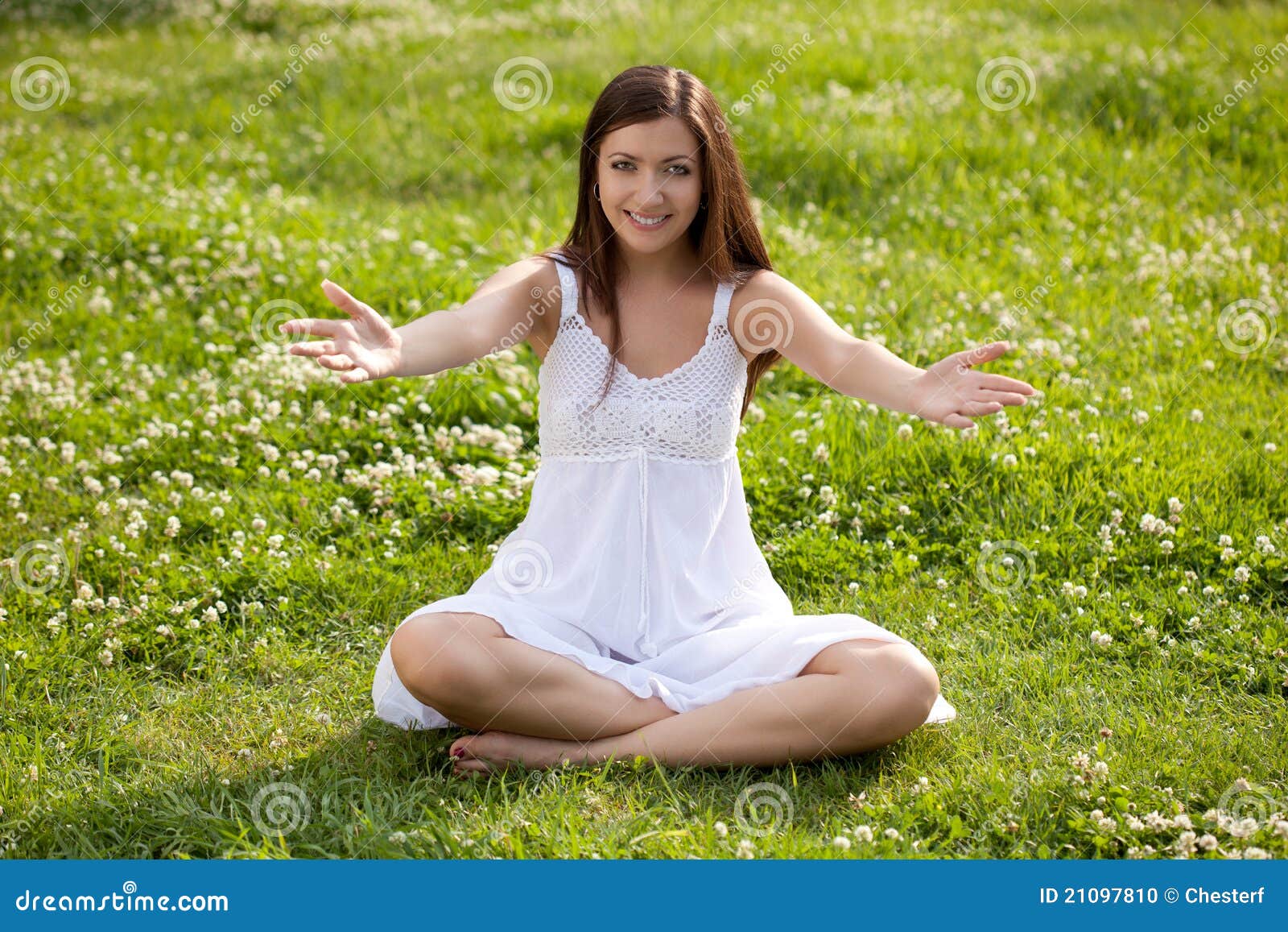Woman sitting on grass stock photo. Image of attractive - 21097810