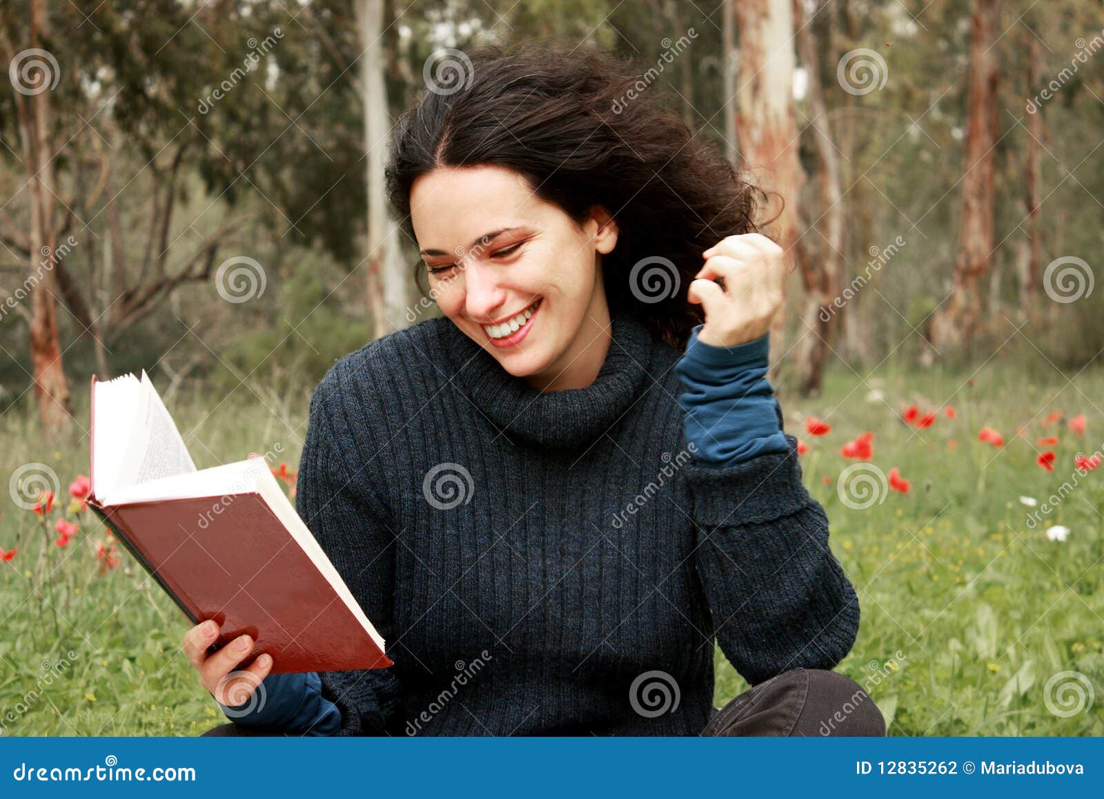 Woman Sitting on the Grass and Reading a Book Stock Photo - Image of ...