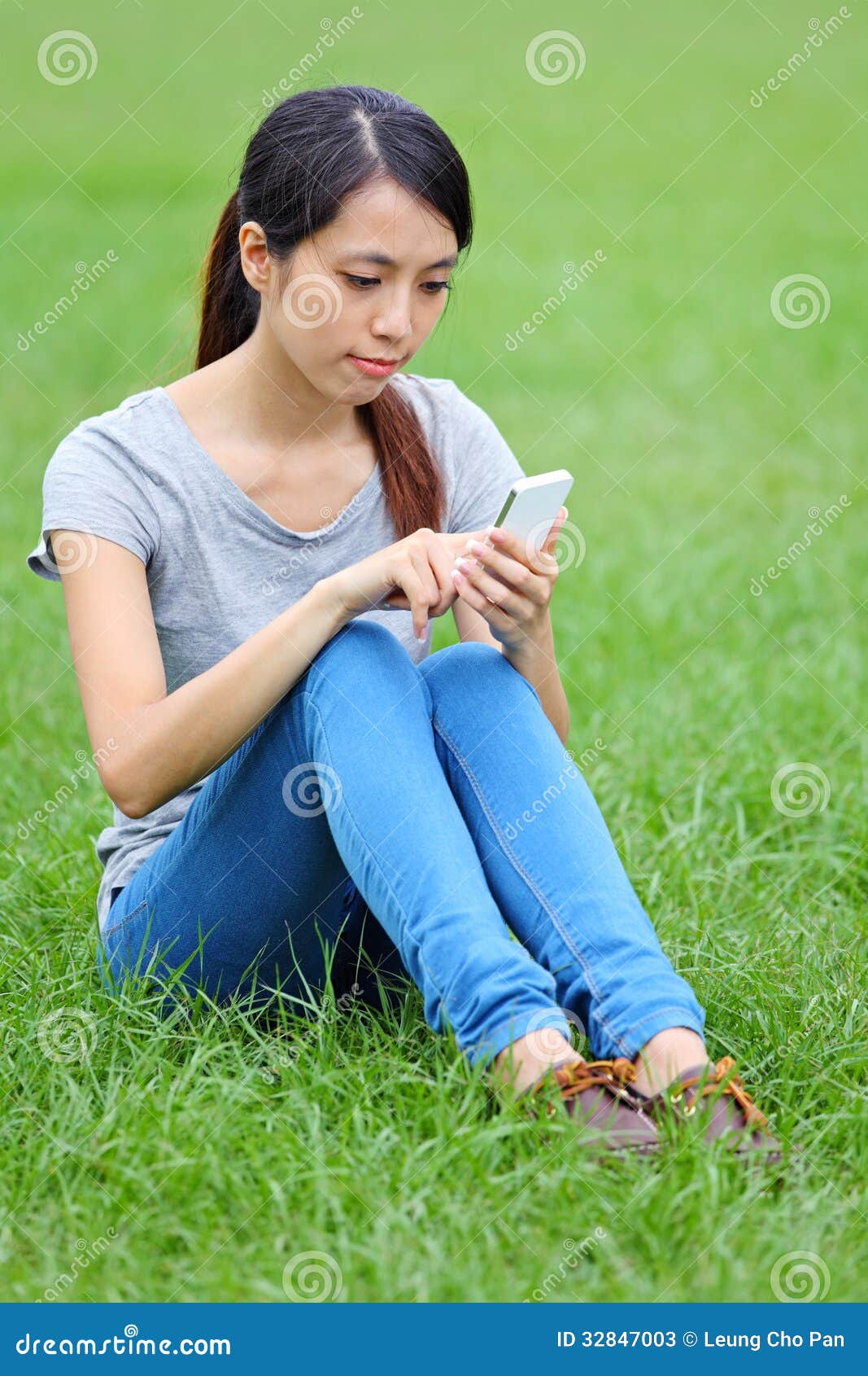 Woman sitting on grass stock image. Image of asian, college - 32847003