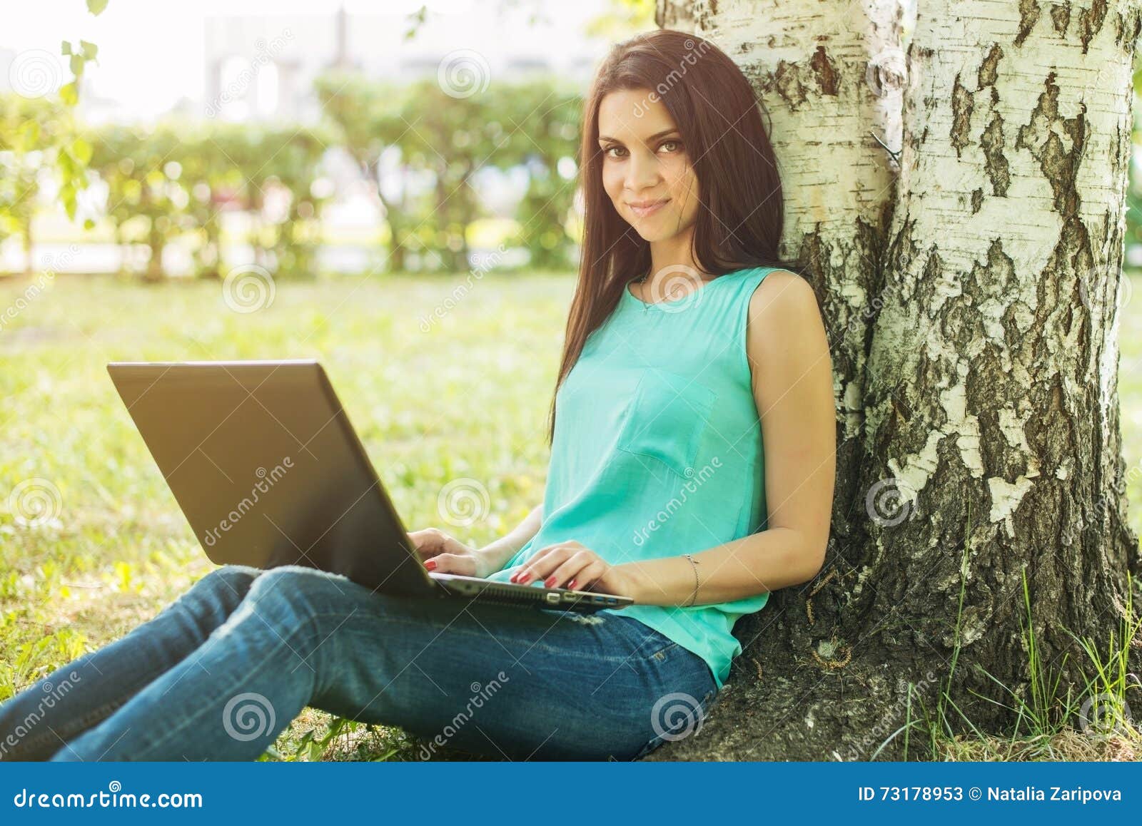 Woman Sitting On Grass Using Laptop And Typing Stock Image Image Of