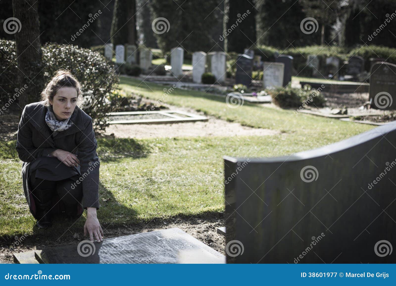 Woman sitting at grave stock image. Image of graveyard - 38601977