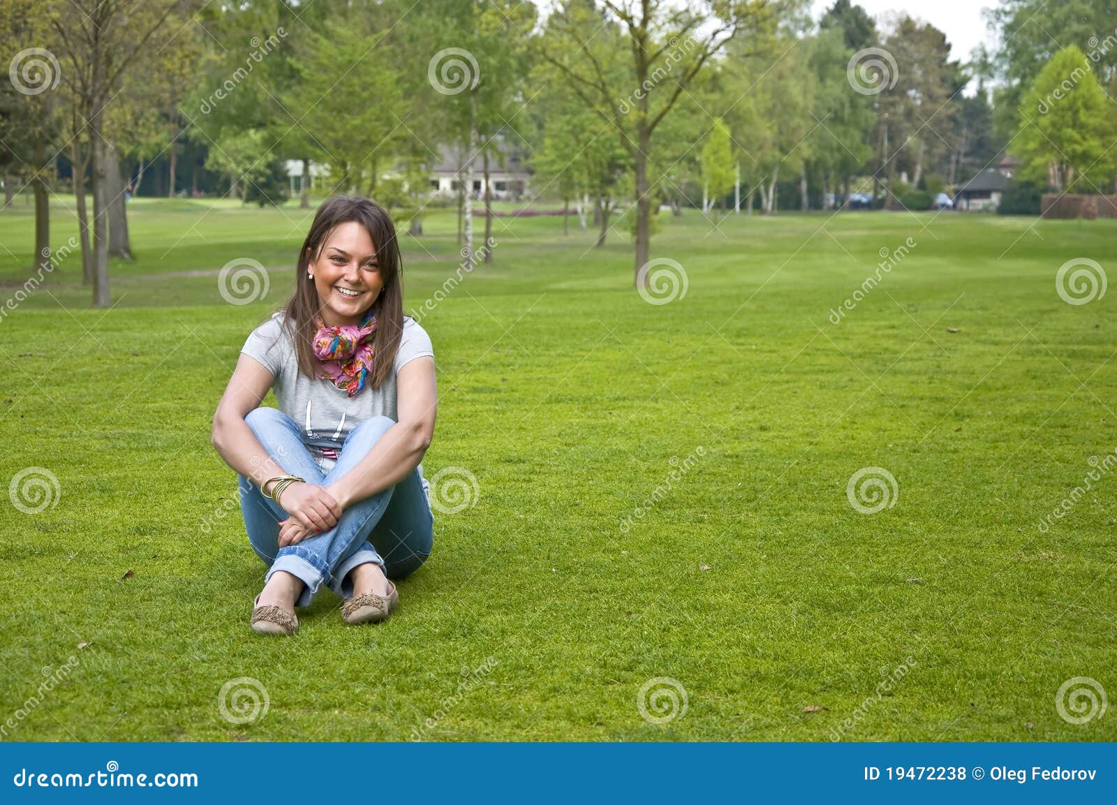 Woman Sitting on a Green Grass Stock Photo - Image of looking, scarf ...