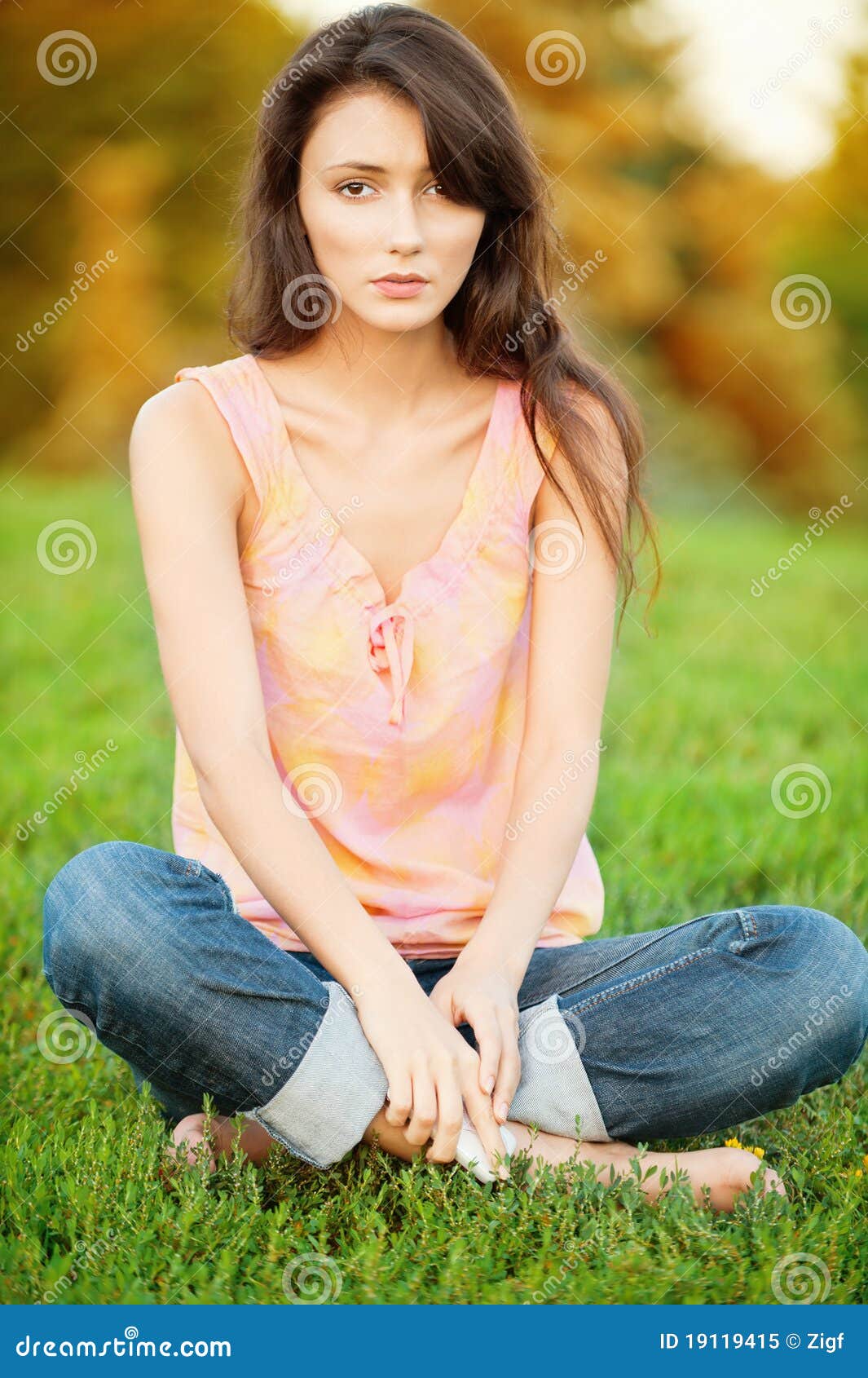 Woman Sitting on a Green Lawn Stock Image - Image of glad, lotus: 19119415