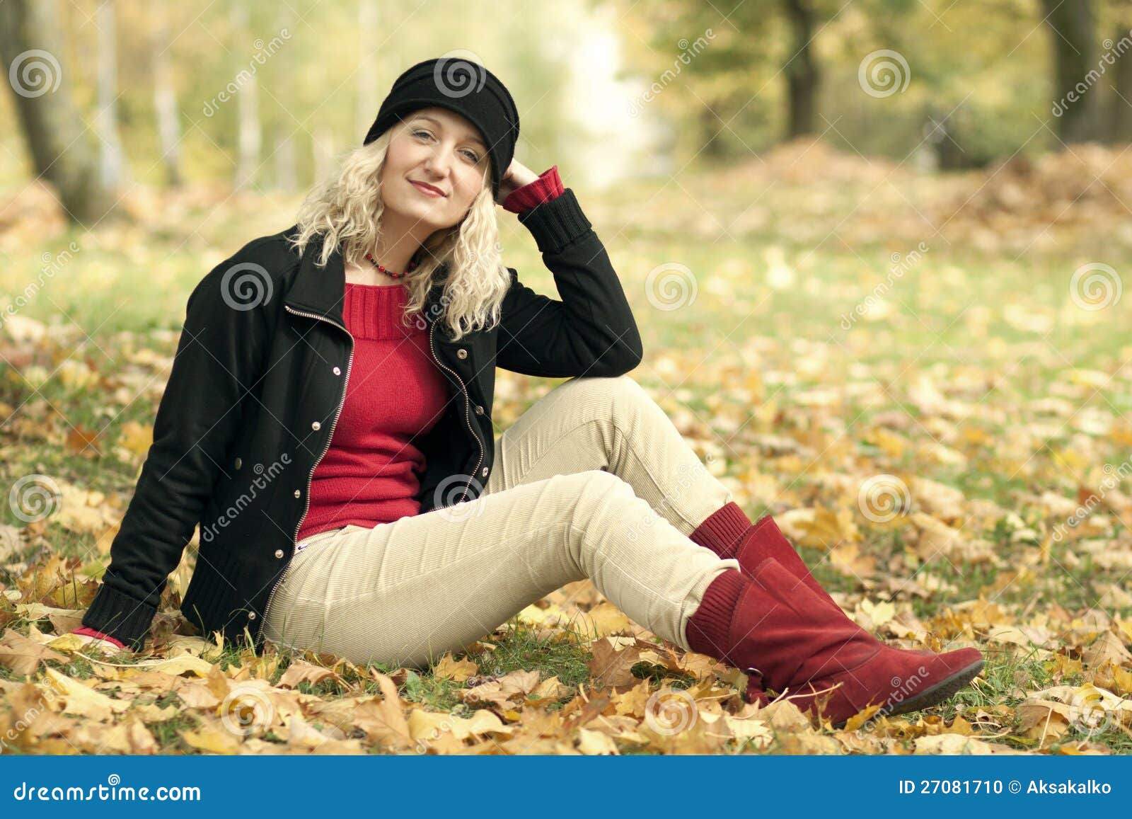 Woman Sitting on the Ground in Park Stock Photo - Image of orange ...