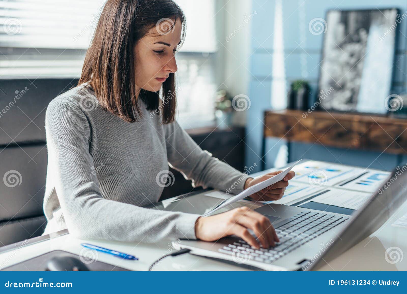 Woman Sitting at Her Desk in the Office and Working Stock Photo - Image ...