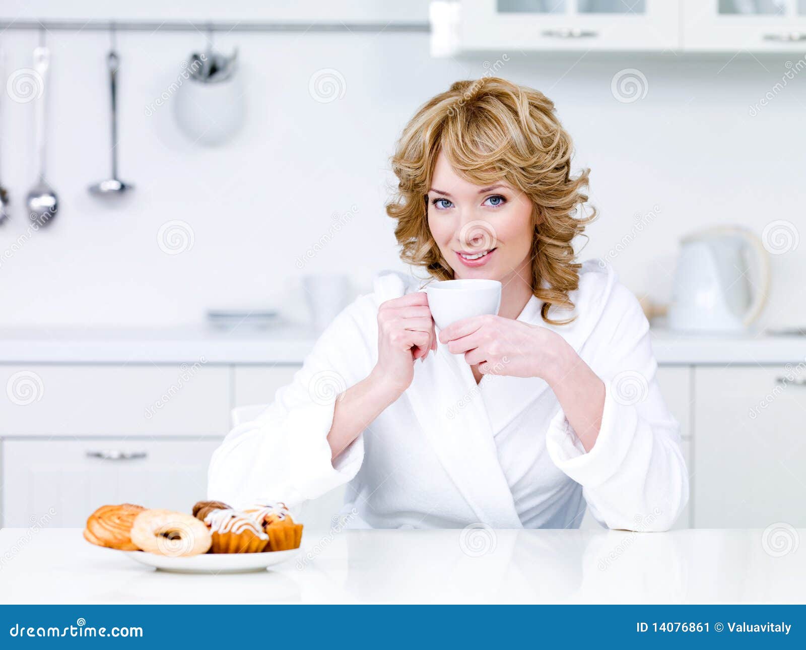 Woman Sitting in the Kitchen and Drinking Coffee Stock Image - Image of ...
