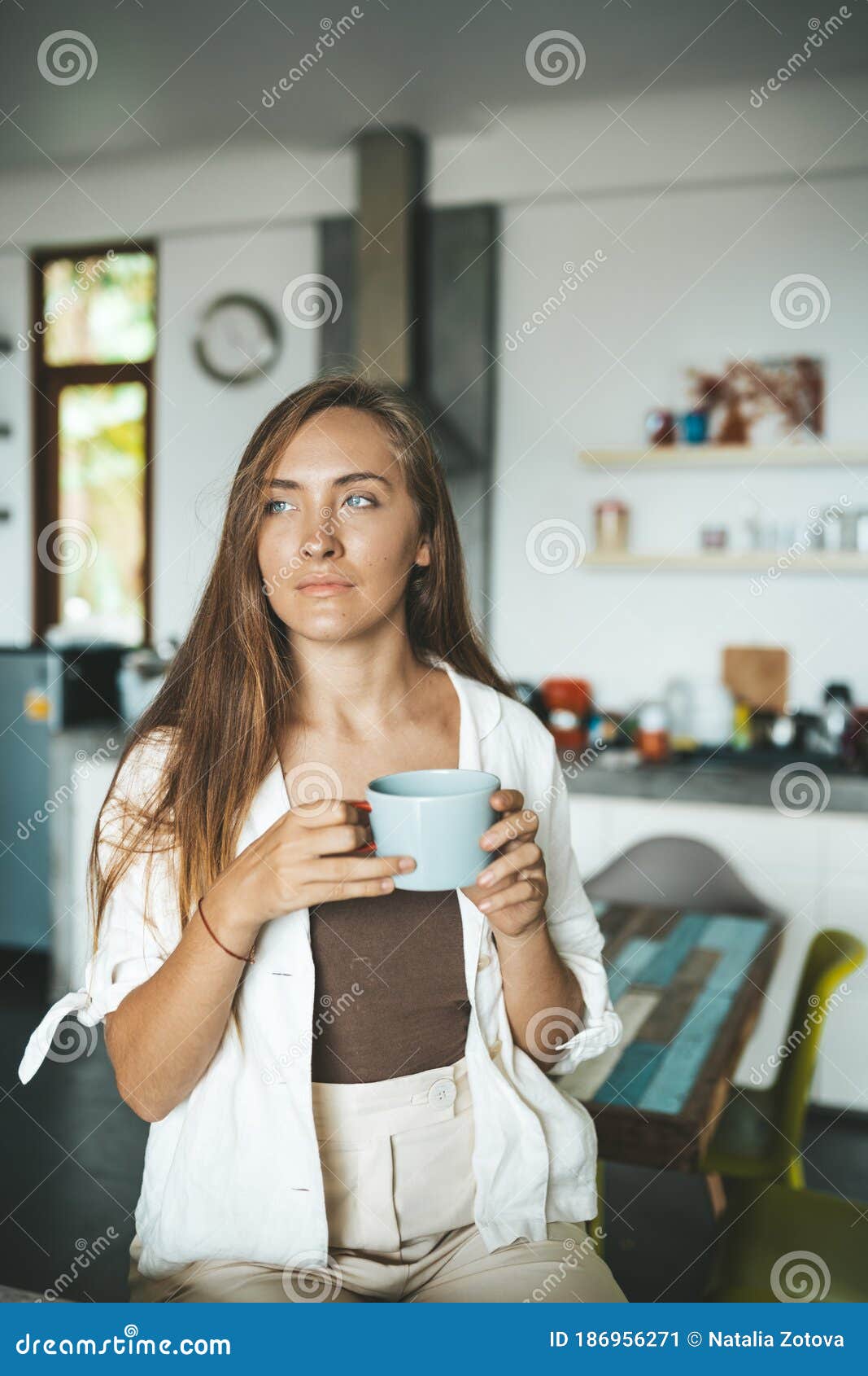 Woman Sitting in the Kitchen and Drinking Coffee Stock Image - Image of ...