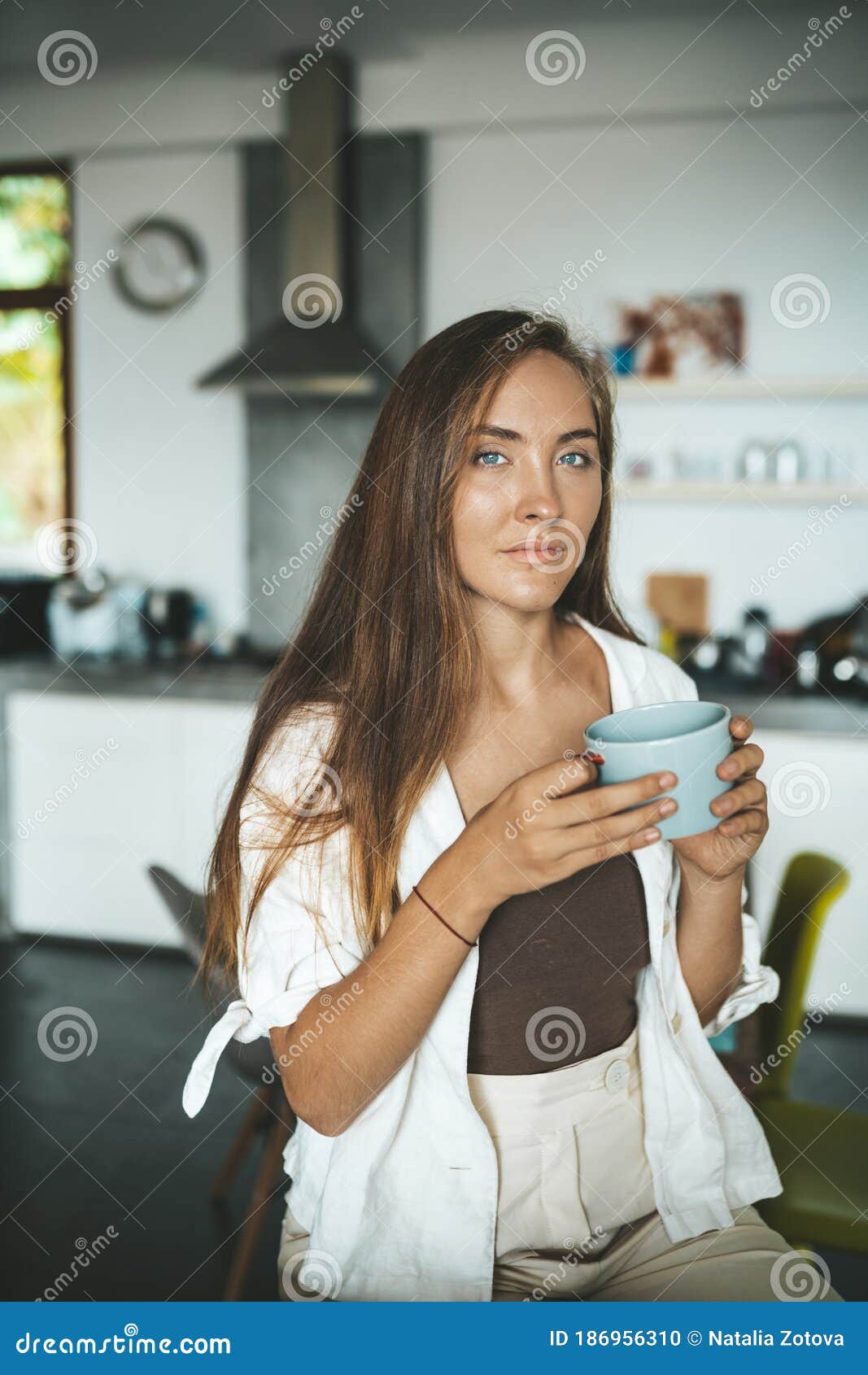Woman Sitting in the Kitchen and Drinking Coffee Stock Photo - Image of ...