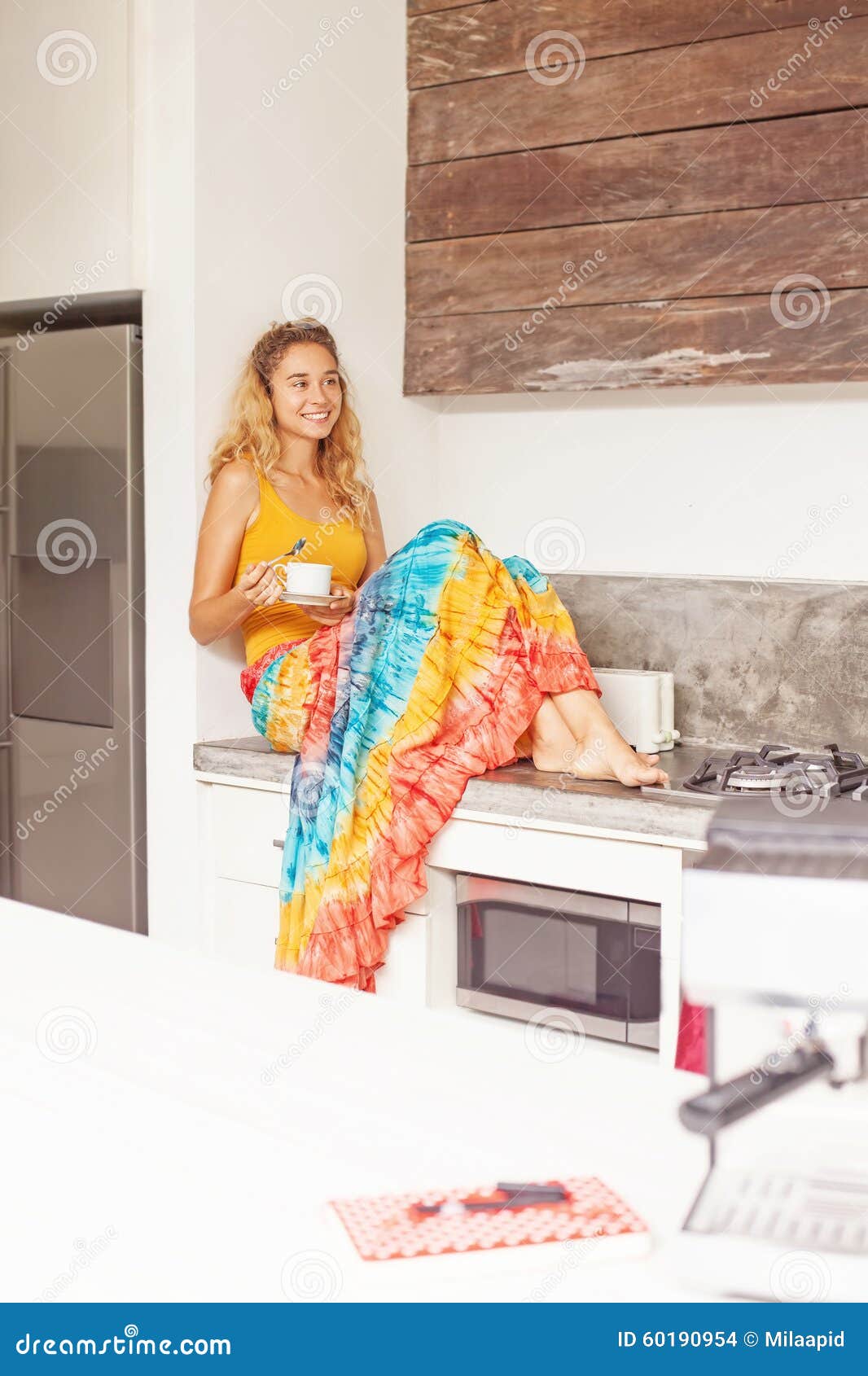 Woman sitting in a kitchen stock photo. Image of girl - 60190954