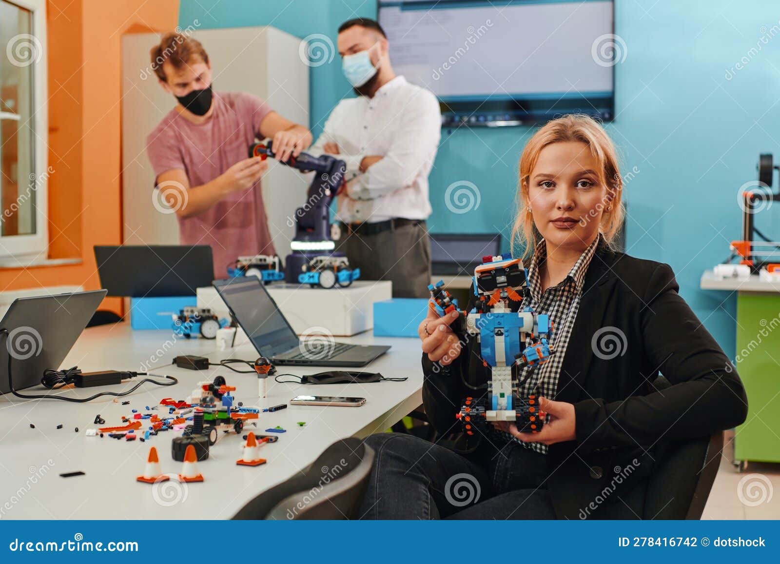 A Woman Sitting in a Laboratory and Solving Problems and Analyzing the ...