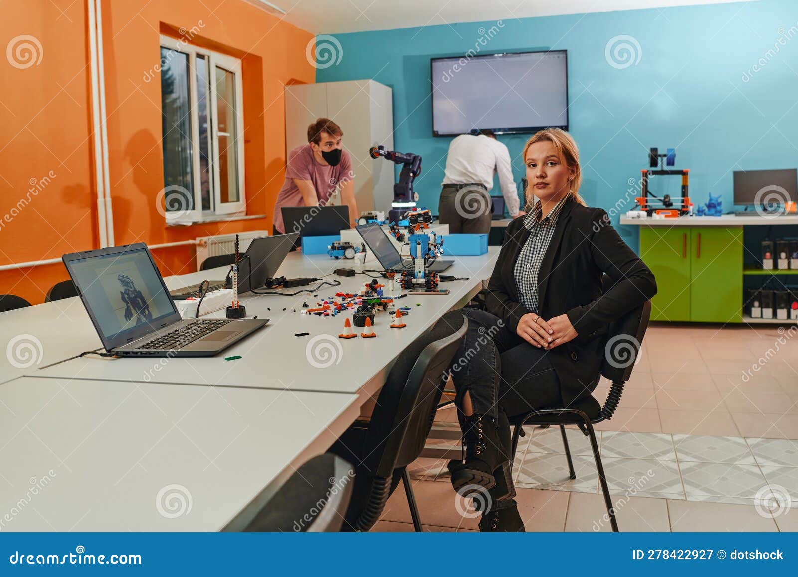 A Woman Sitting in a Laboratory and Solving Problems and Analyzing the ...
