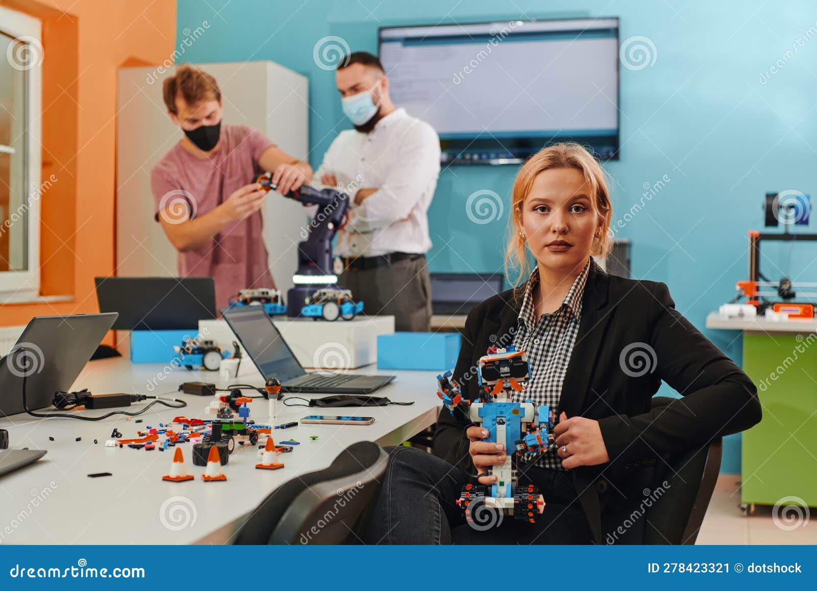 A Woman Sitting in a Laboratory and Solving Problems and Analyzing the ...