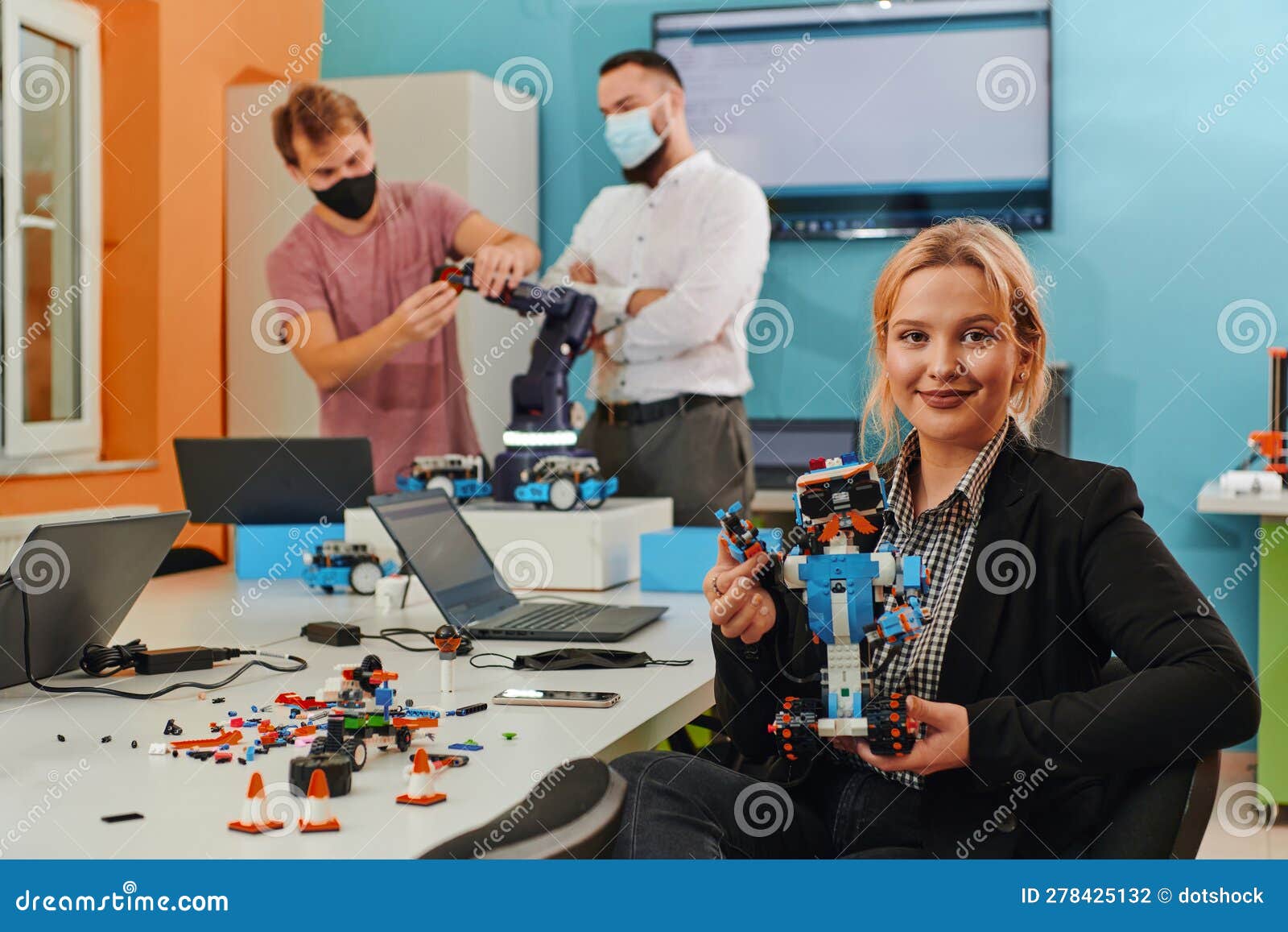 A Woman Sitting in a Laboratory and Solving Problems and Analyzing the ...