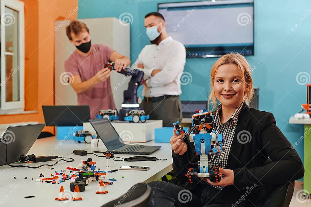 A Woman Sitting in a Laboratory and Solving Problems and Analyzing the ...