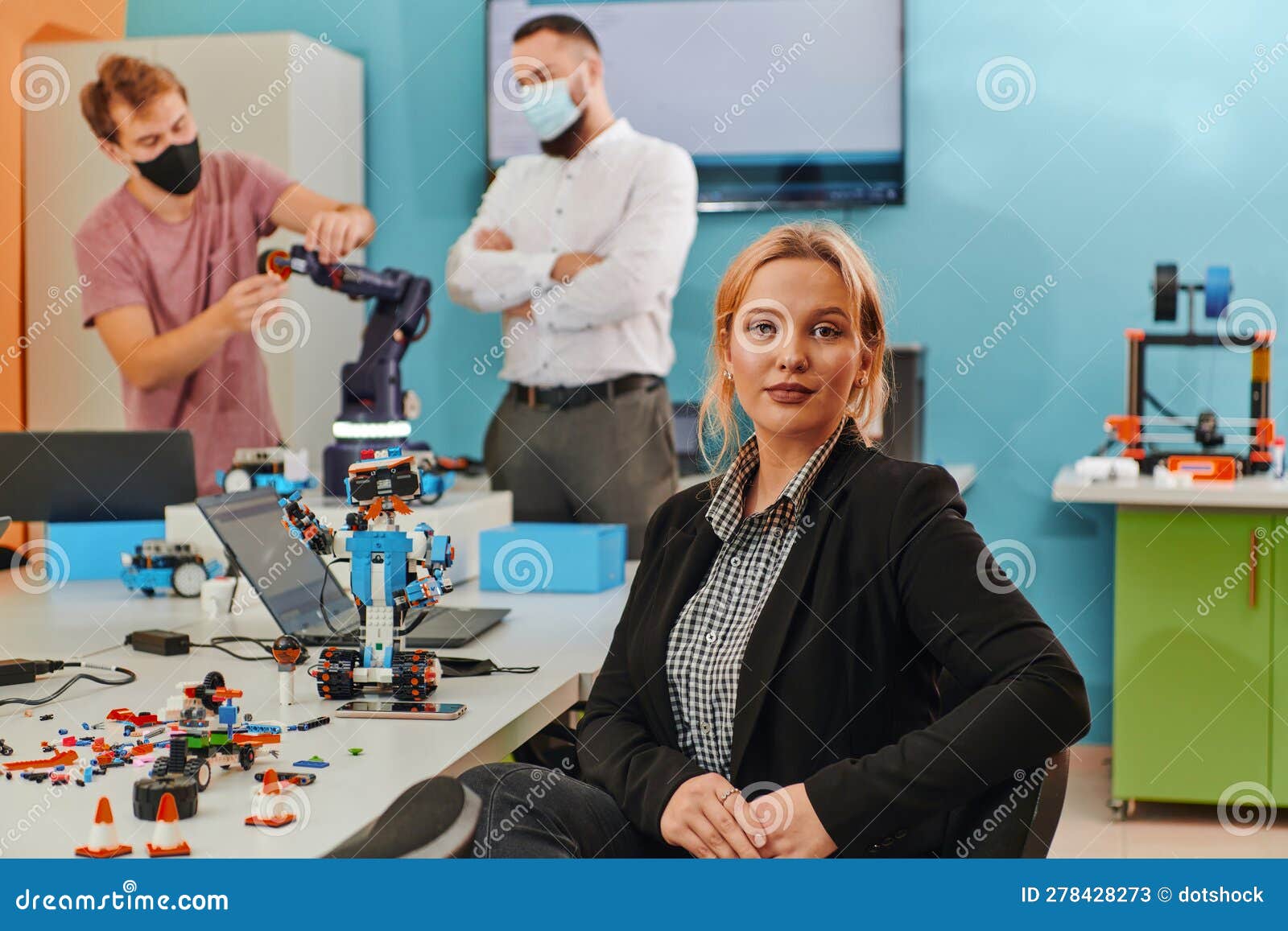 A Woman Sitting in a Laboratory and Solving Problems and Analyzing the ...