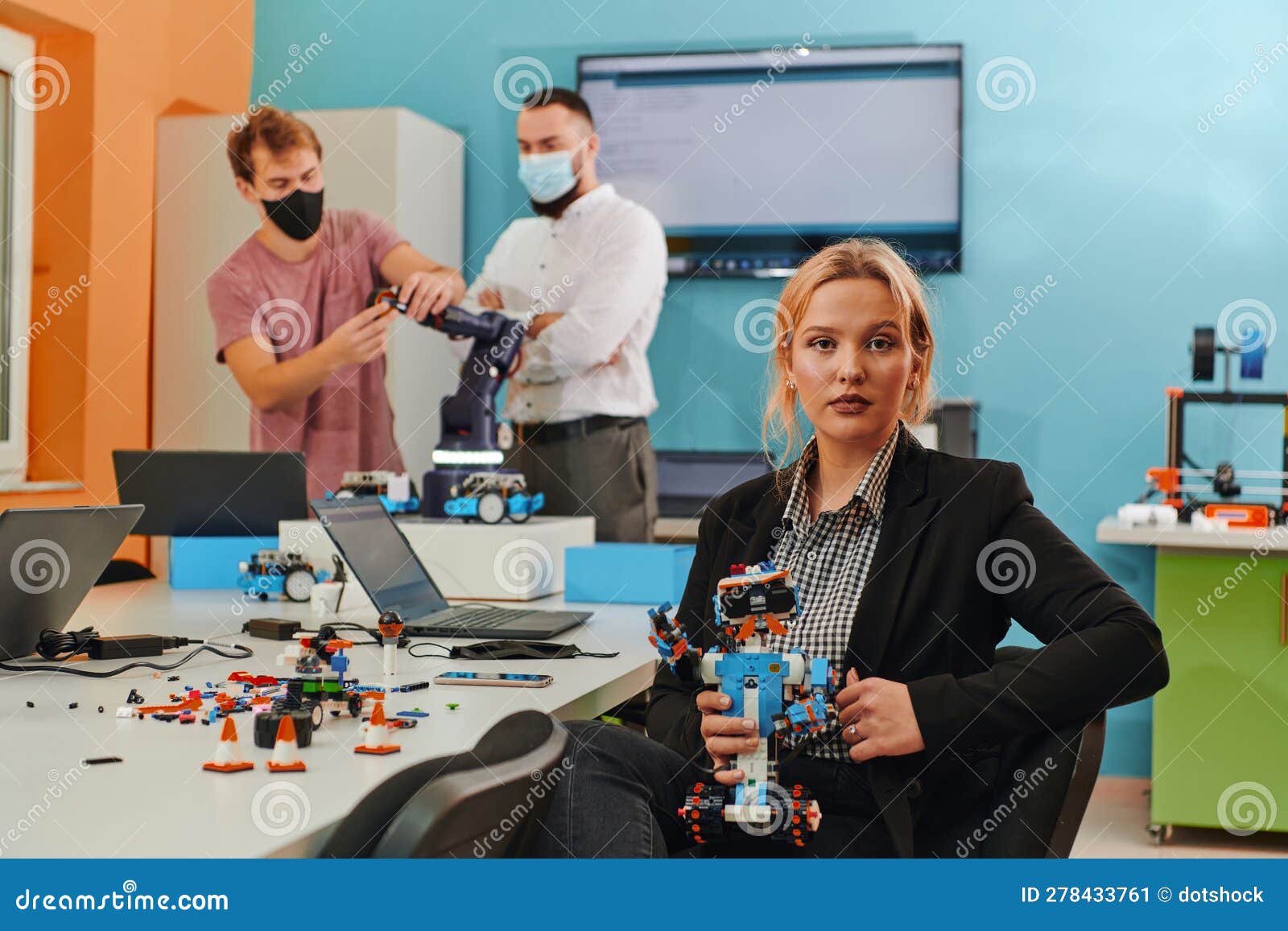 A Woman Sitting in a Laboratory and Solving Problems and Analyzing the ...