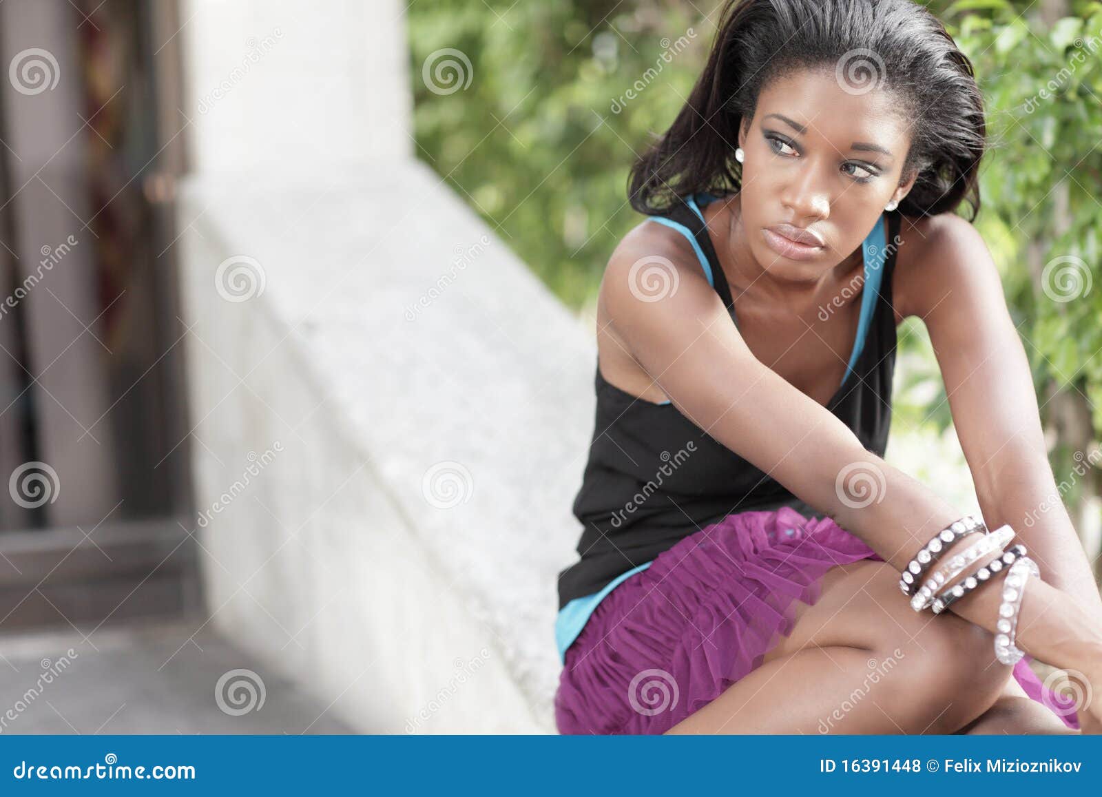 Woman sitting on the ledge stock photo. Image of strait - 16391448