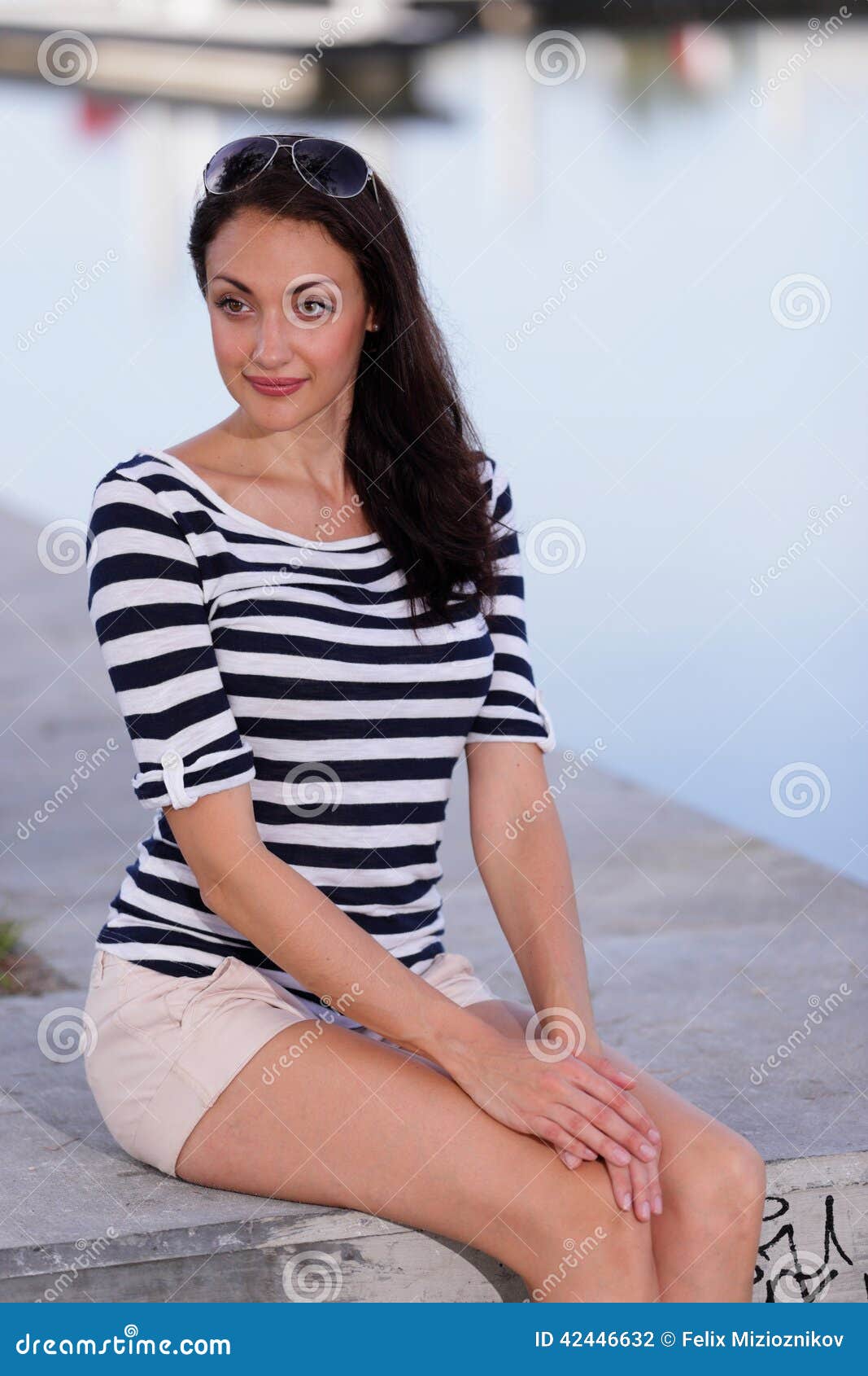Woman sitting on a ledge stock photo. Image of water - 42446632 Woman sitting on a ledge stock photo. Image of water - 42446632