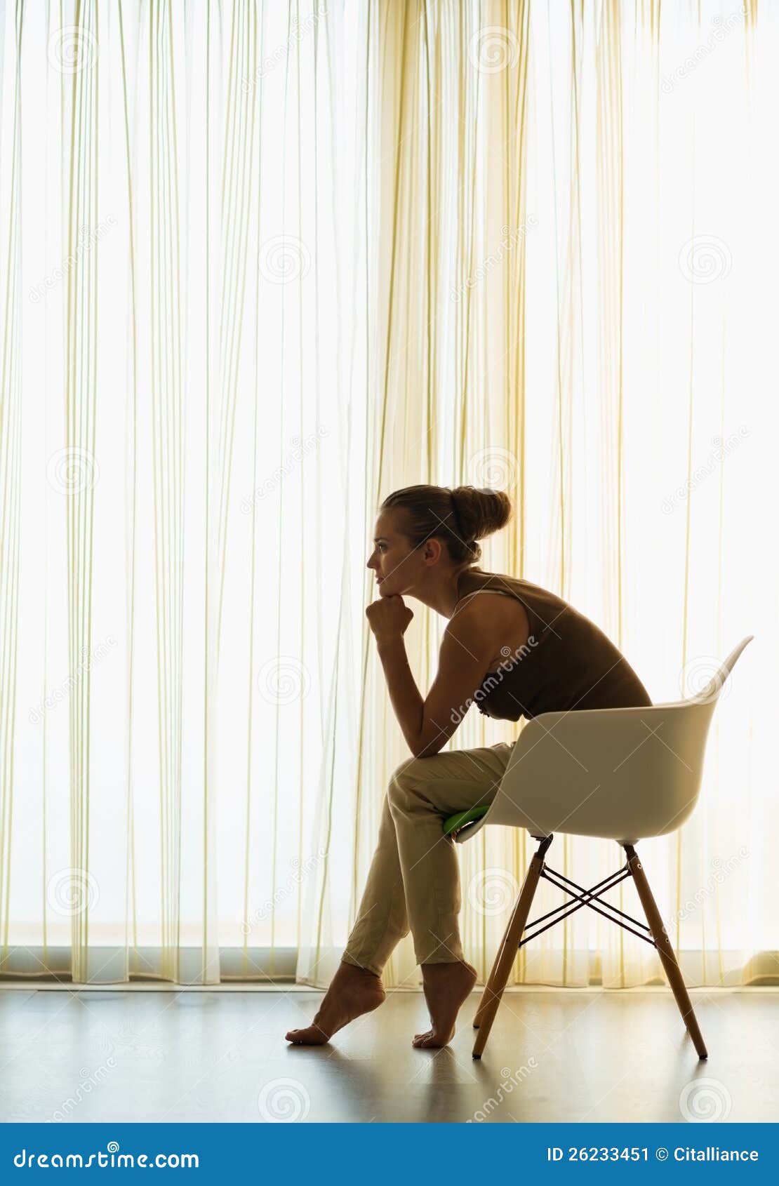 Woman Sitting Near Window in Thoughtful Pose Stock Image - Image of ...