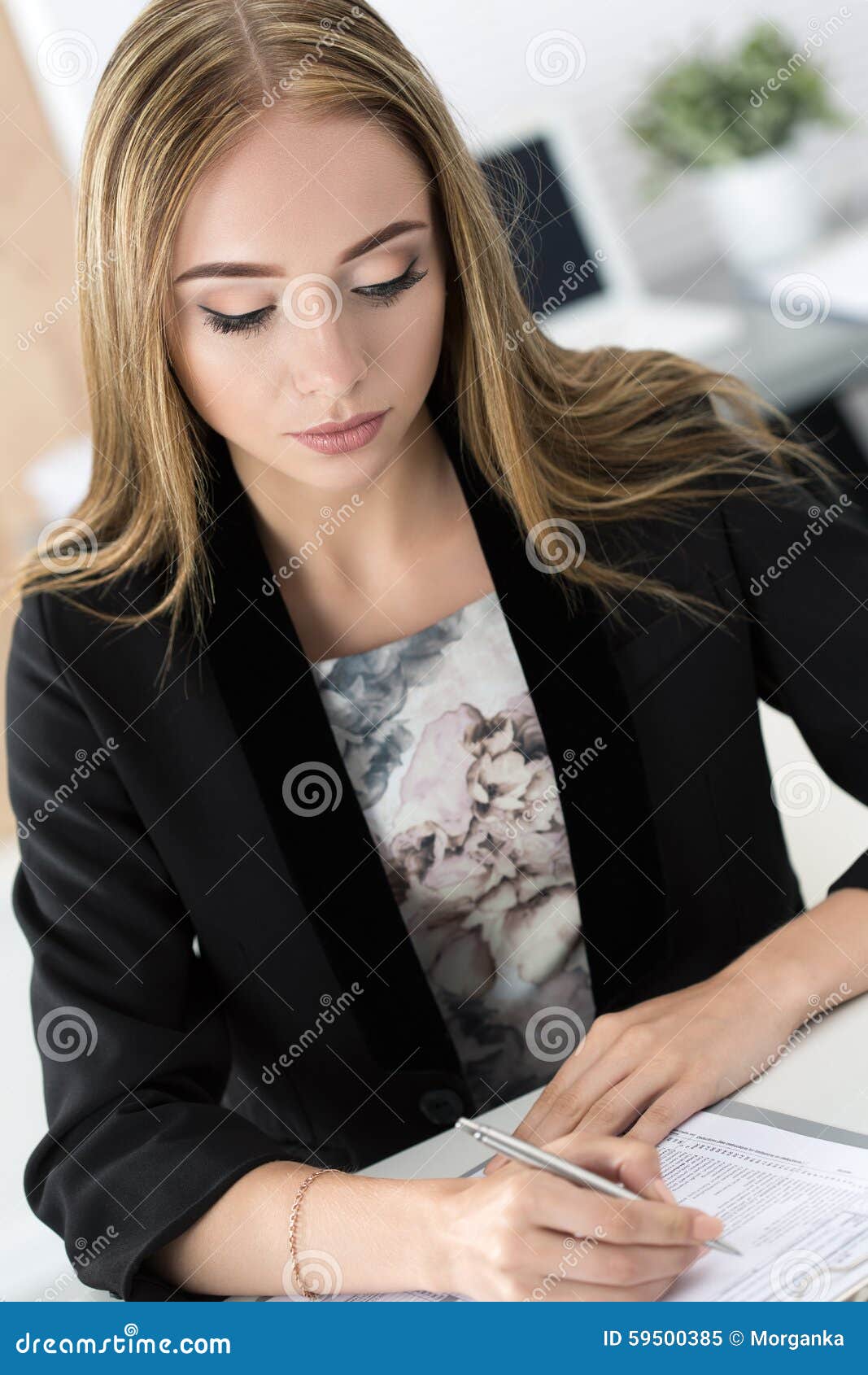 Woman Sitting at the Office and Signing Some Documents Stock Image ...