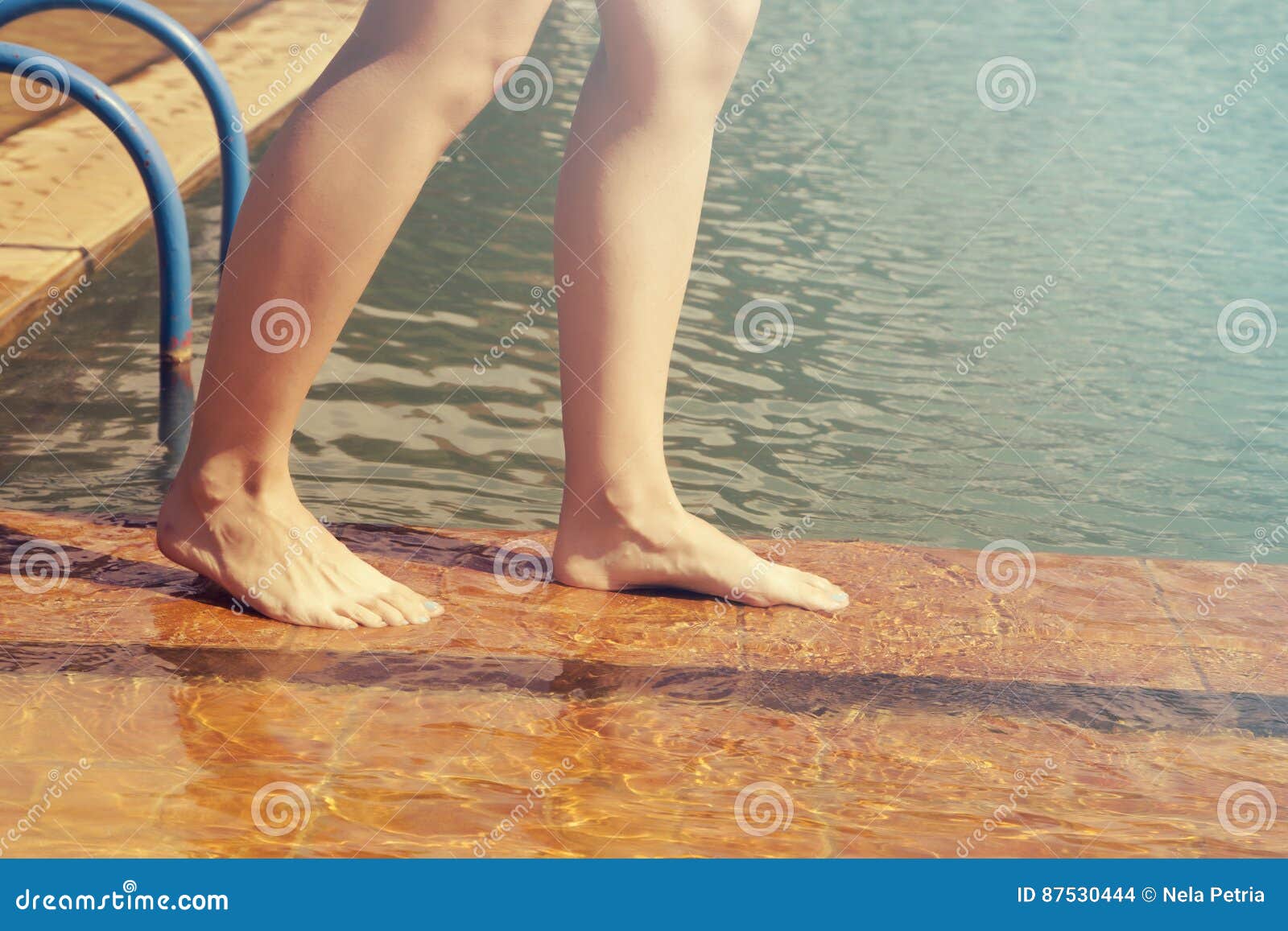 Woman sitting by the pool stock photo. Image of living - 87530444