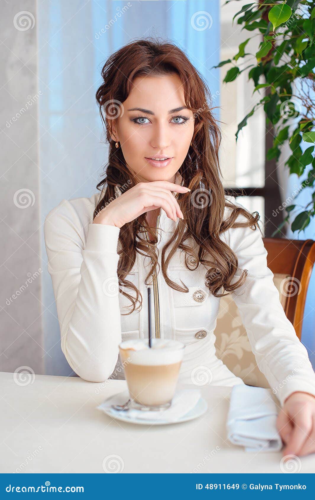 Woman Sitting In A Restaurant Looking At The Camera Stock Image Image