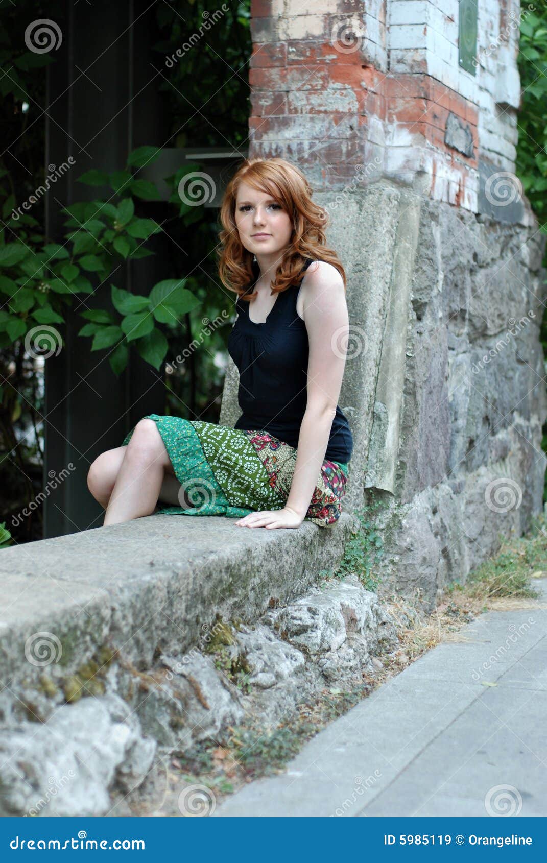 Woman Sitting on Rock Ledge - Vertical Stock Image - Image of outdoors ...