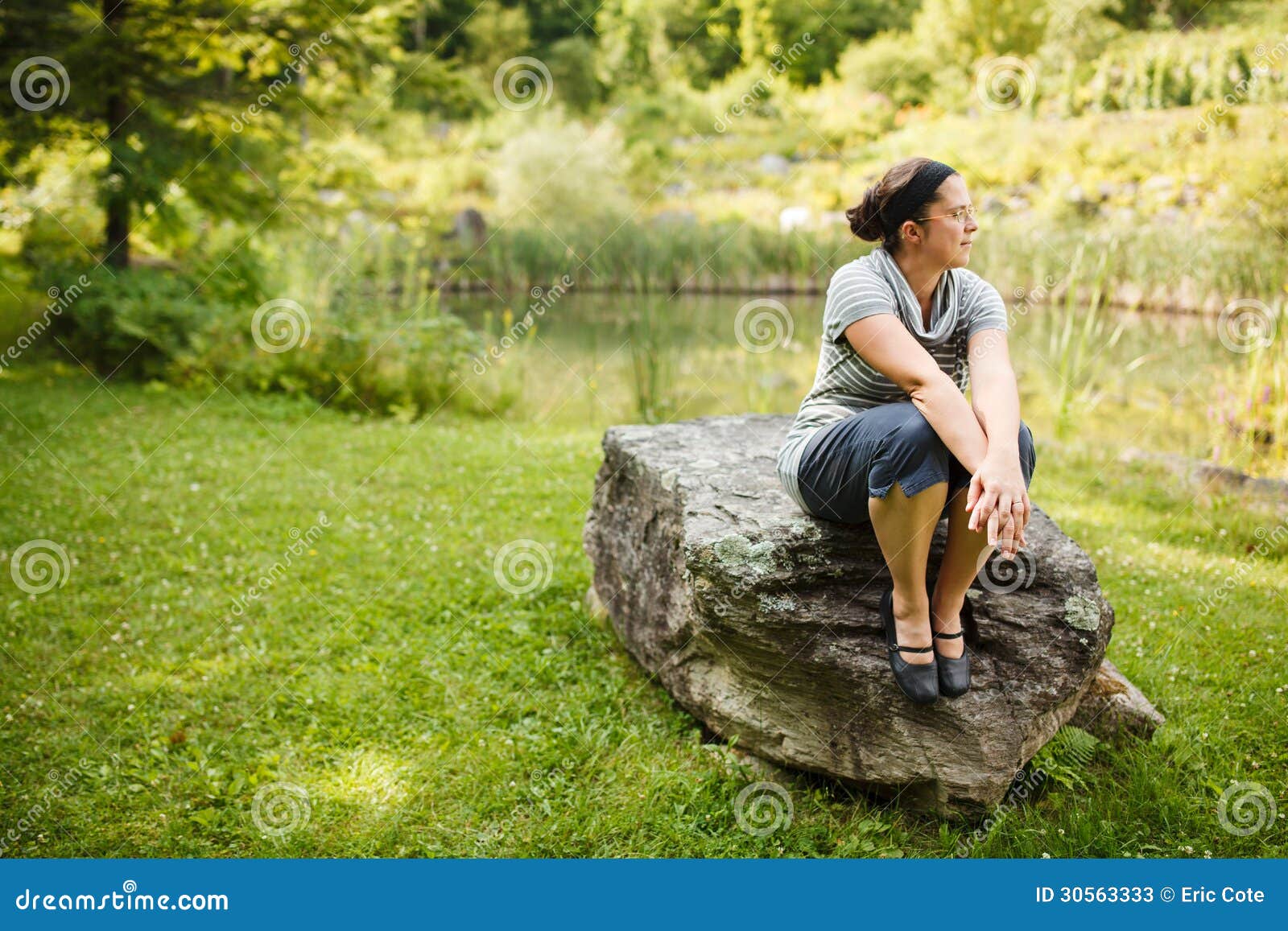 Woman sitting on a rock stock image. Image of outdoor - 30563333