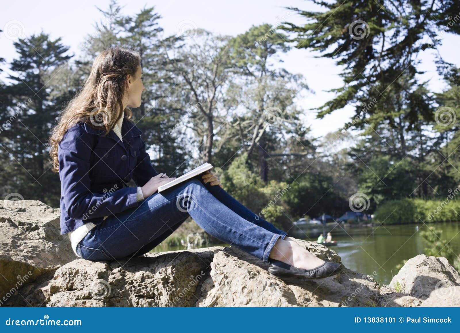 Woman Sitting on Rocks stock image. Image of water, leisure - 13838101
