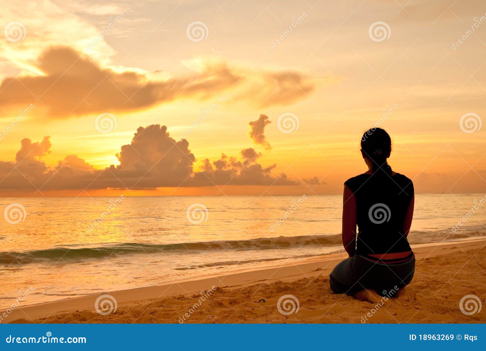 Woman Sitting on a Sand Beach in Front of Sunset Stock Image - Image of ...