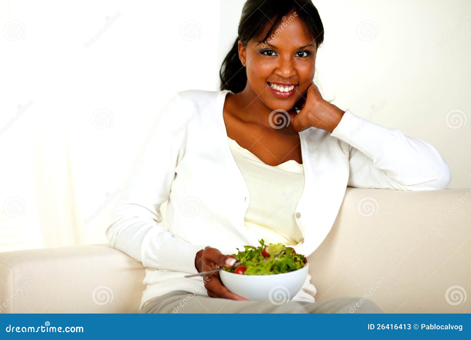Woman Sitting on Sofa and Holding Vegetable Salad Stock Image - Image ...
