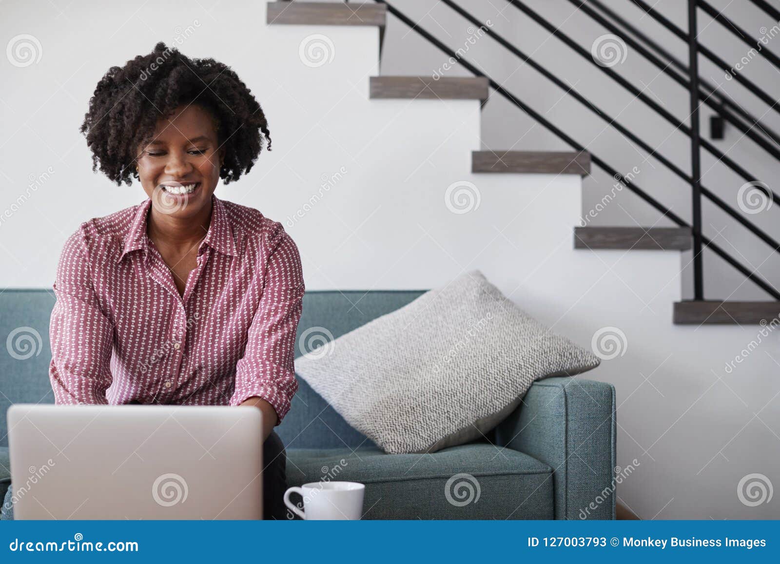 Woman Sitting on Sofa at Home Using Laptop Computer Stock Image - Image ...