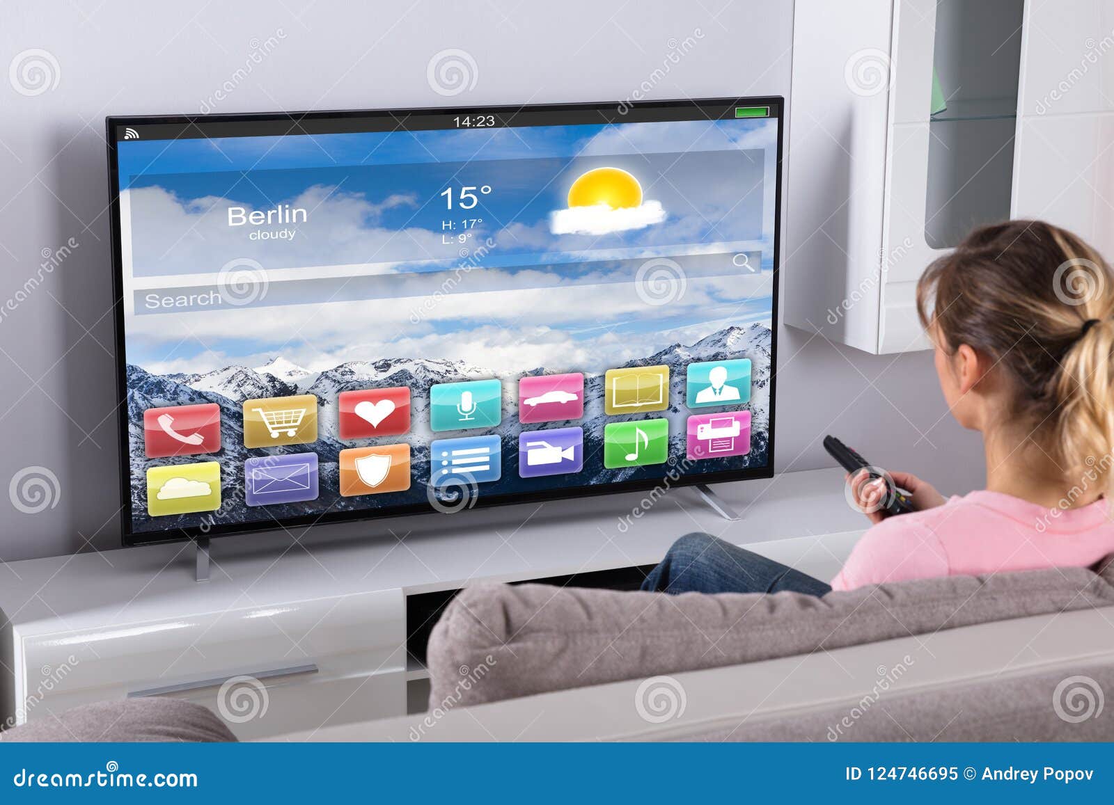 Woman Sitting on Sofa Using Remote Control Stock Image - Image of movie ...