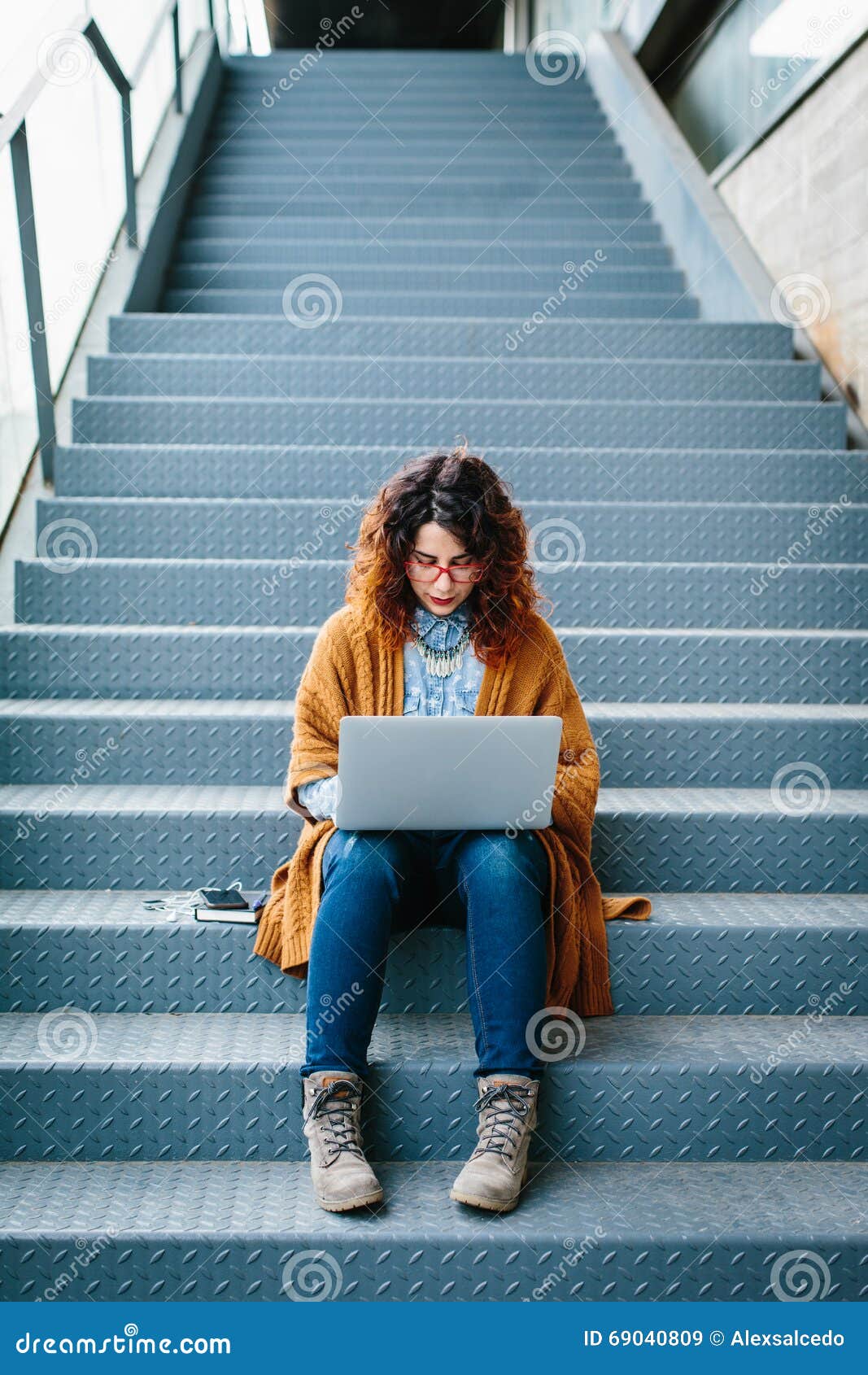 Woman Sitting on Stairs while Using Laptop Stock Image - Image of ...
