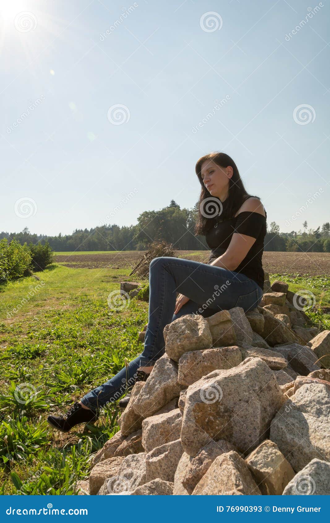Woman Sitting on a Stone Wall Stock Image - Image of sitting, freedom ...