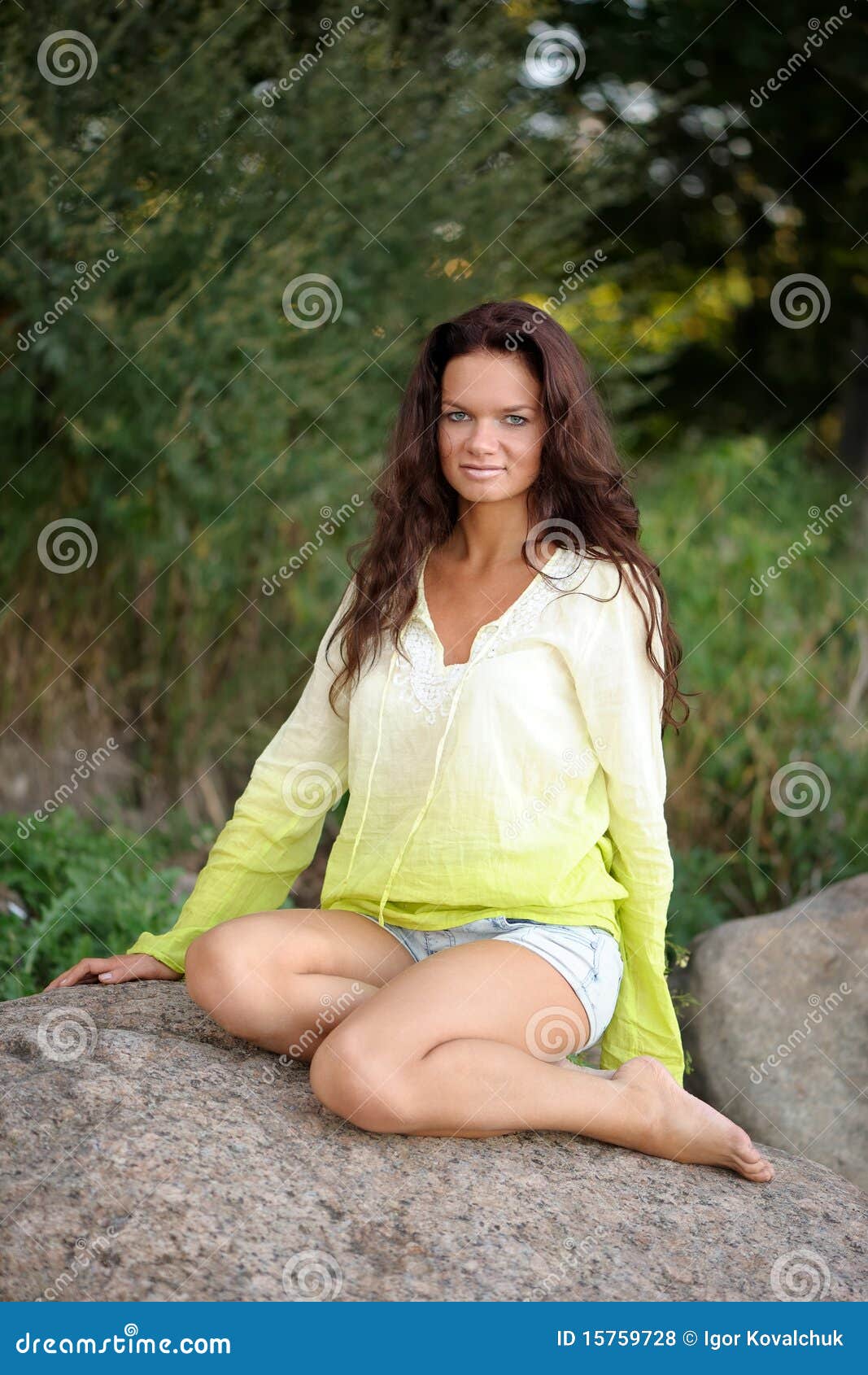 Woman sitting on stones stock photo. Image of natural - 15759728