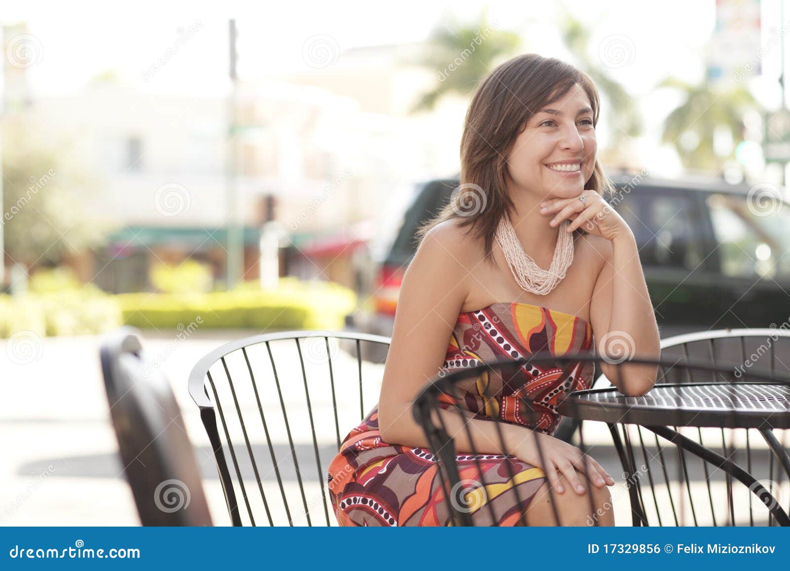 Woman sitting at a table stock photo. Image of white - 17329856