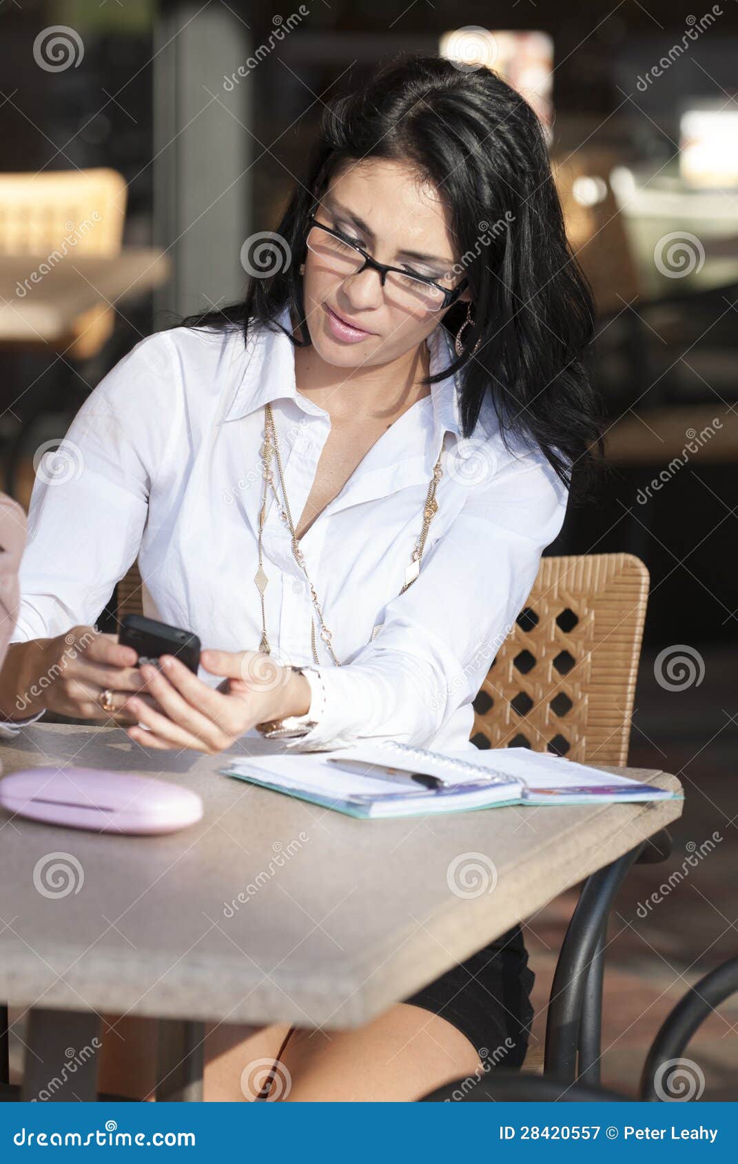 Woman sitting at a table stock image. Image of beautiful - 28420557