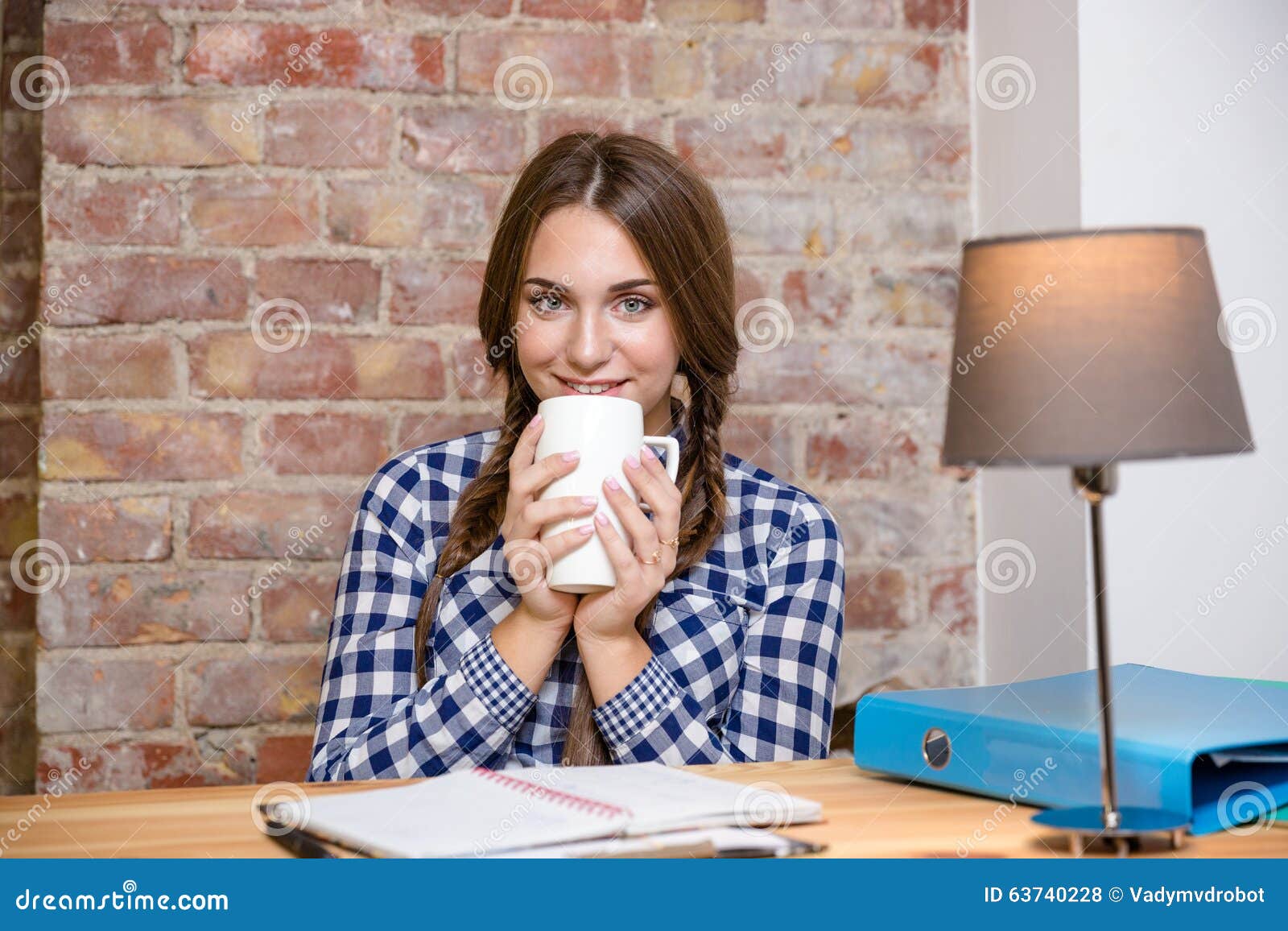 Woman Sitting at the Table and Drinking Tea Stock Photo - Image of ...