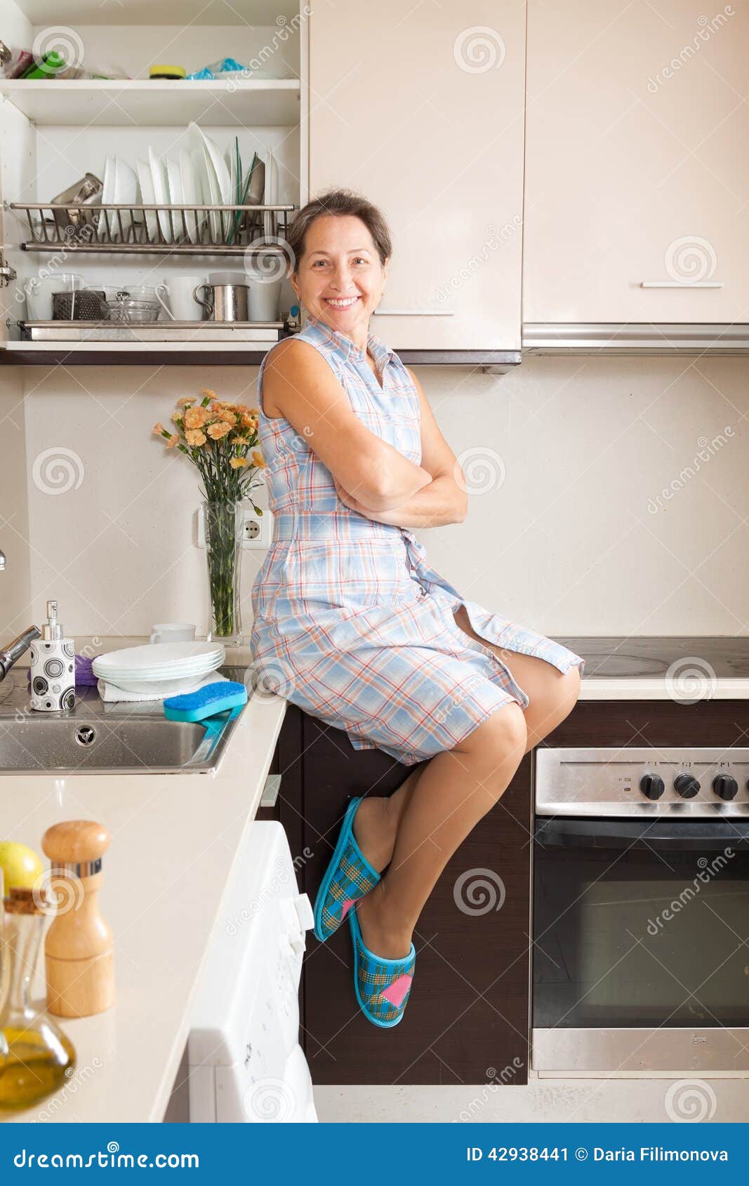 Woman Sitting on Table at Kitchen Stock Image - Image of adult, open ...