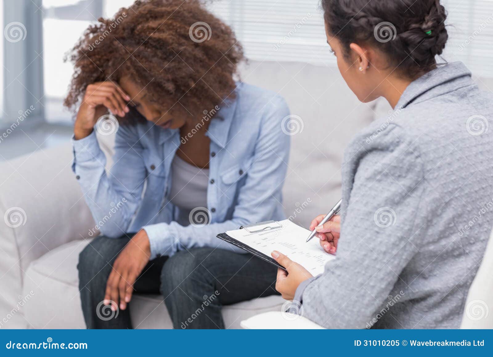 Woman Sitting on Therapists Couch Looking Down Stock Image - Image of ...