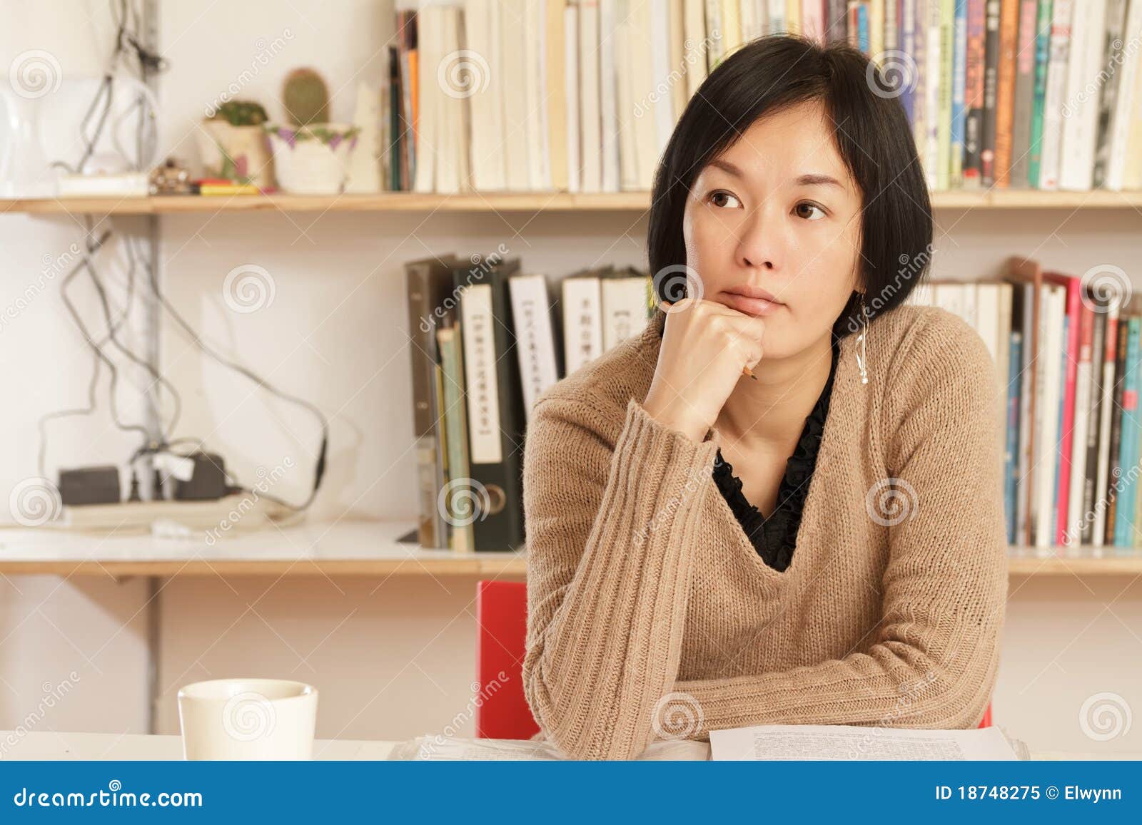 Woman sitting and thinking stock image. Image of looking - 18748275