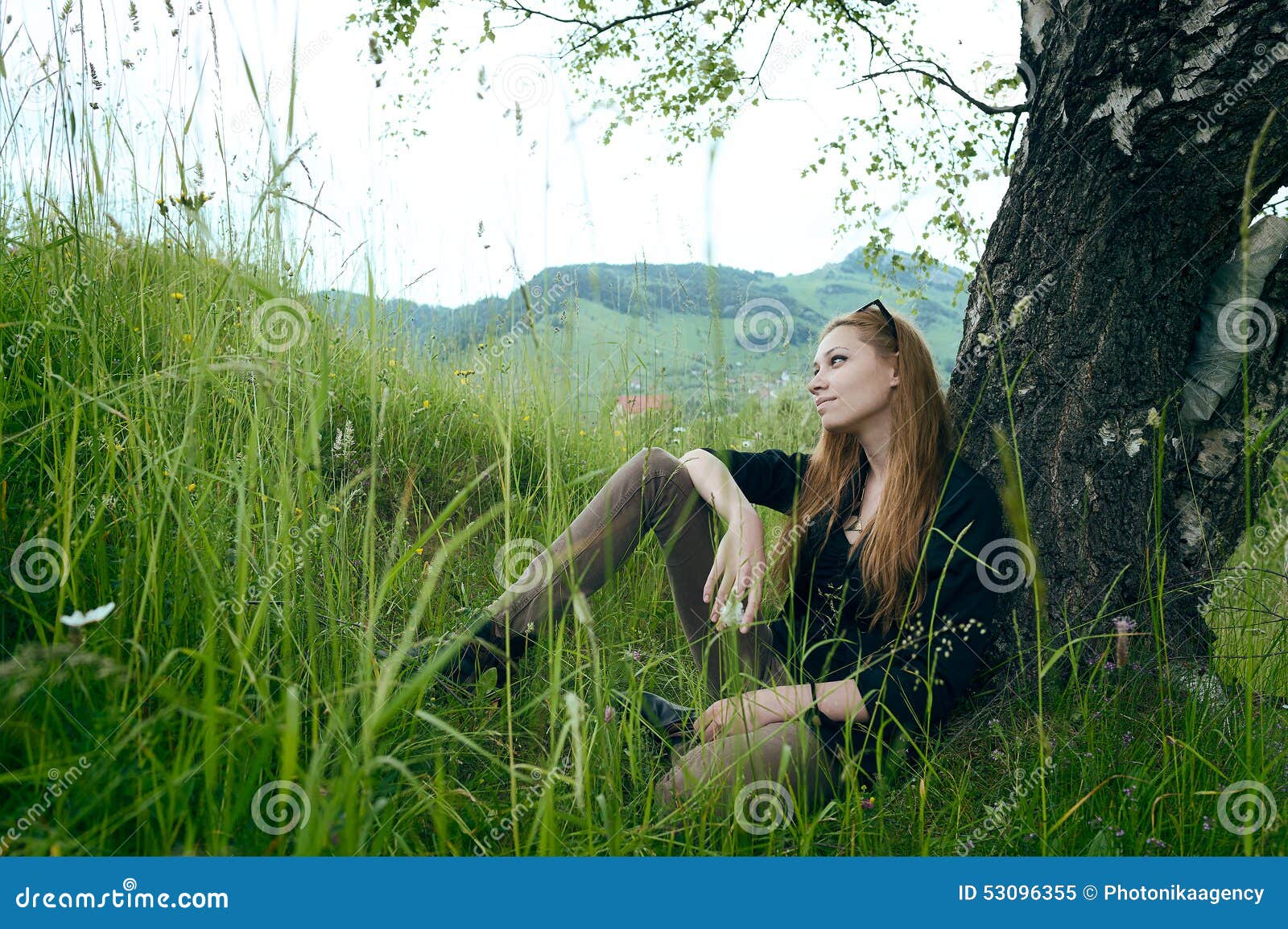 Woman sitting under tree stock image. Image of female - 53096355